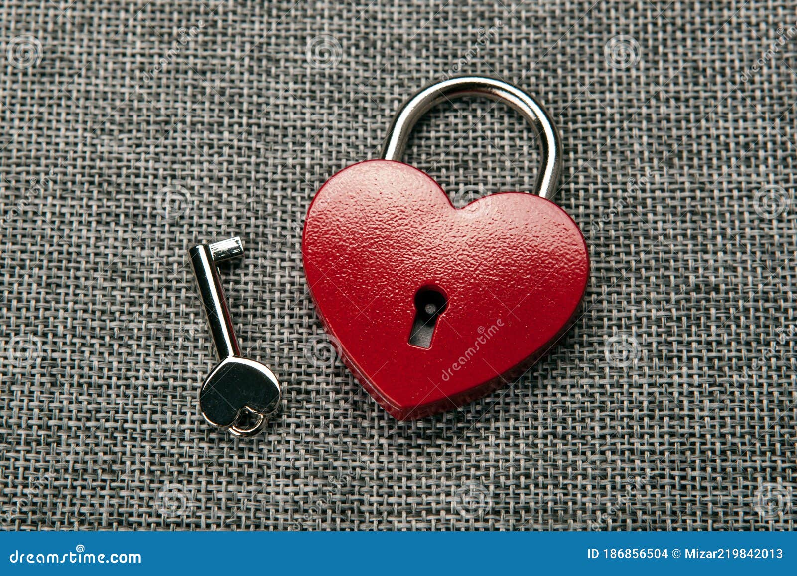 Red Heart Shaped Padlock with a Key on Gray Linen Stock Photo - Image ...
