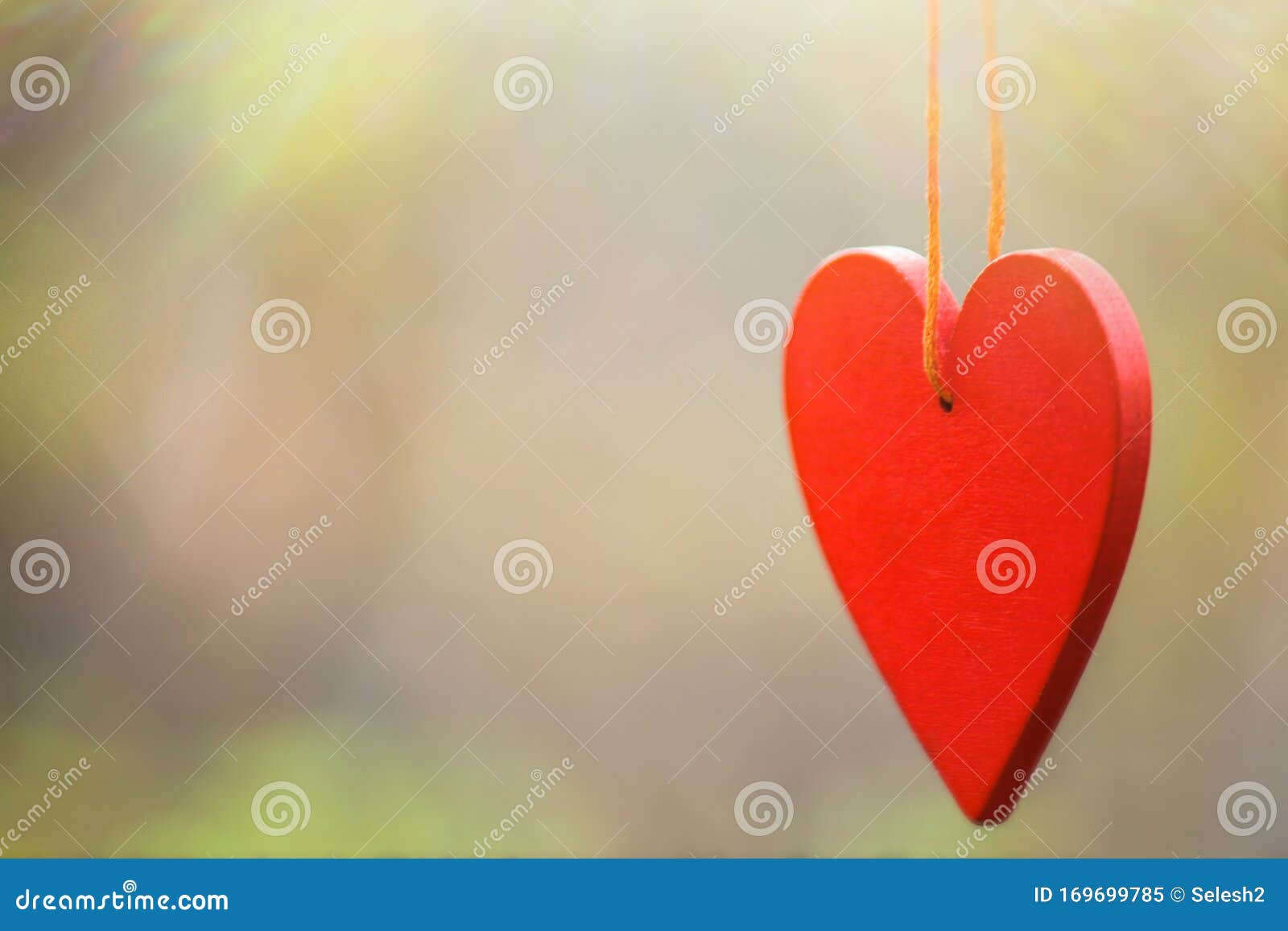Red Heart on a String on a Beautiful Blurred Background. Stock Image ...