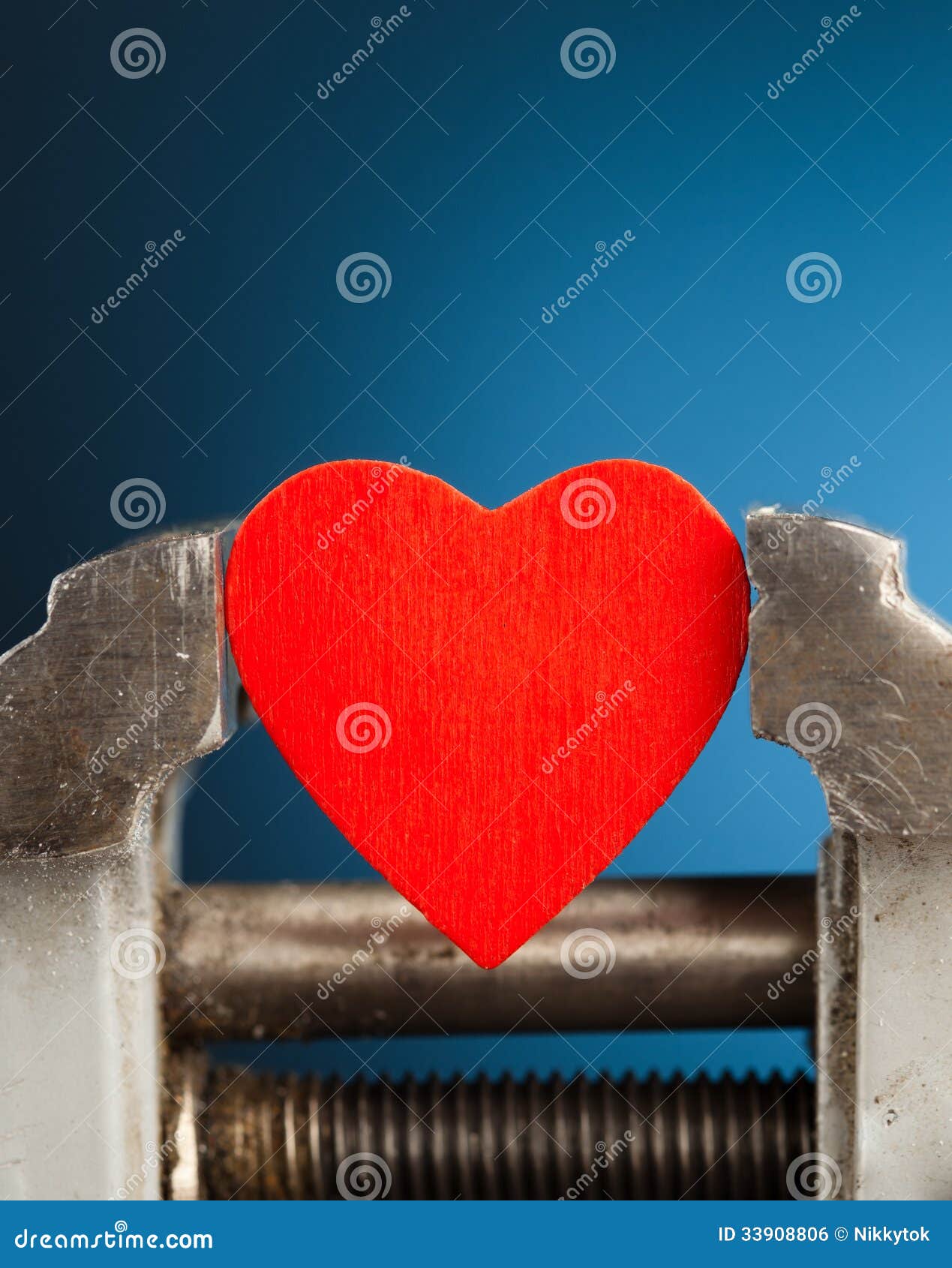 Red heart in the vice tool stock photo. Image of metallic - 33908806