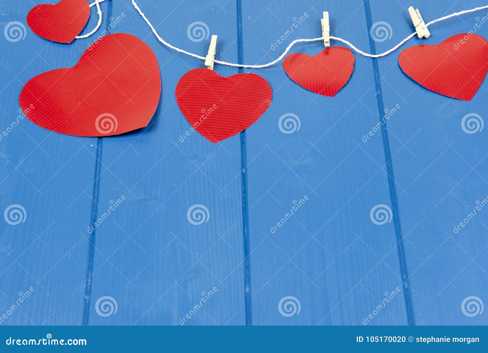 Red Hearts on a String on a Blue Background Stock Photo - Image of arts ...