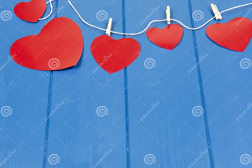 Red Hearts on a String on a Blue Background Stock Photo - Image of arts ...