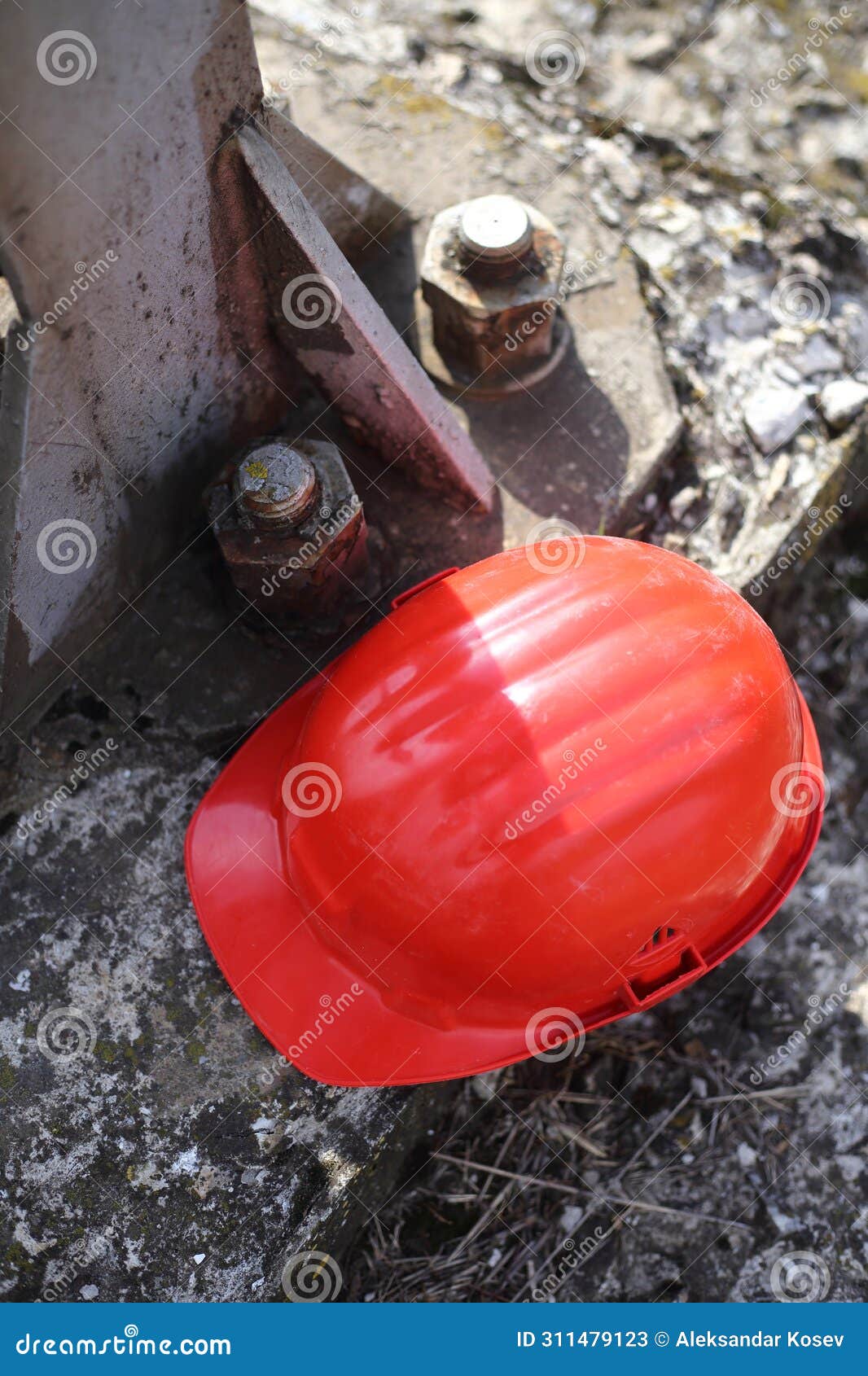 Red helmet on a work site stock image. Image of construction - 311479123