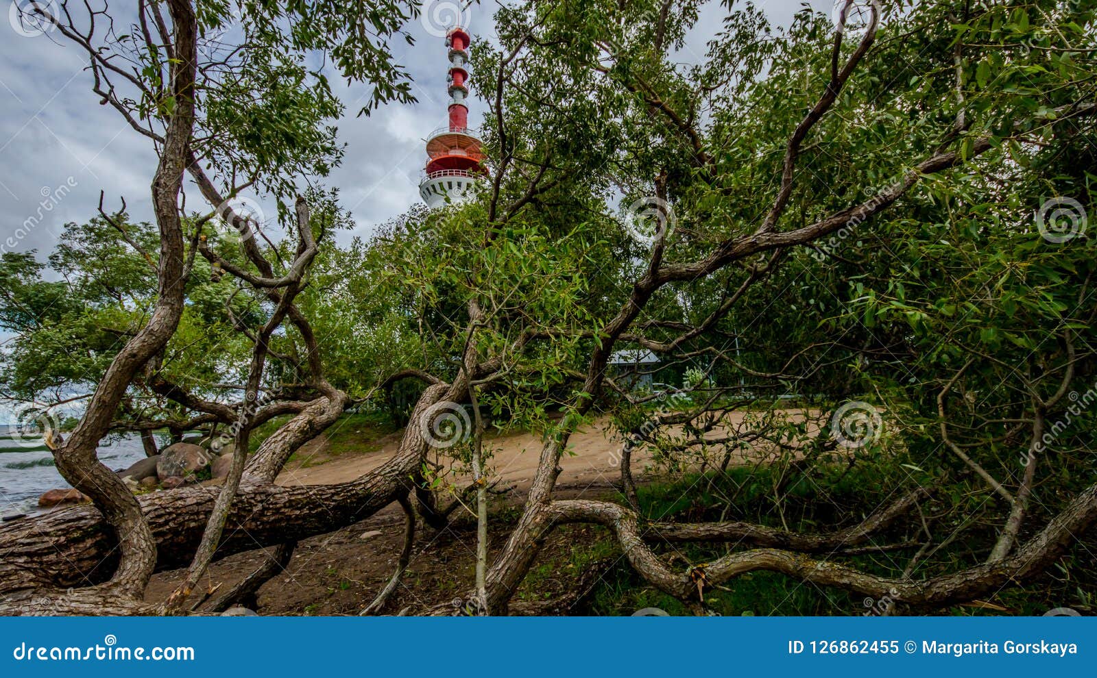 Red Lighthouse on the sea stock image. Image of evening - 126862455