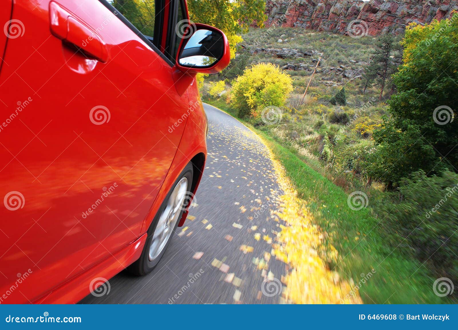 Red Honda Fit Driving in Fall Time Stock Photo - Image of yellow, side ...