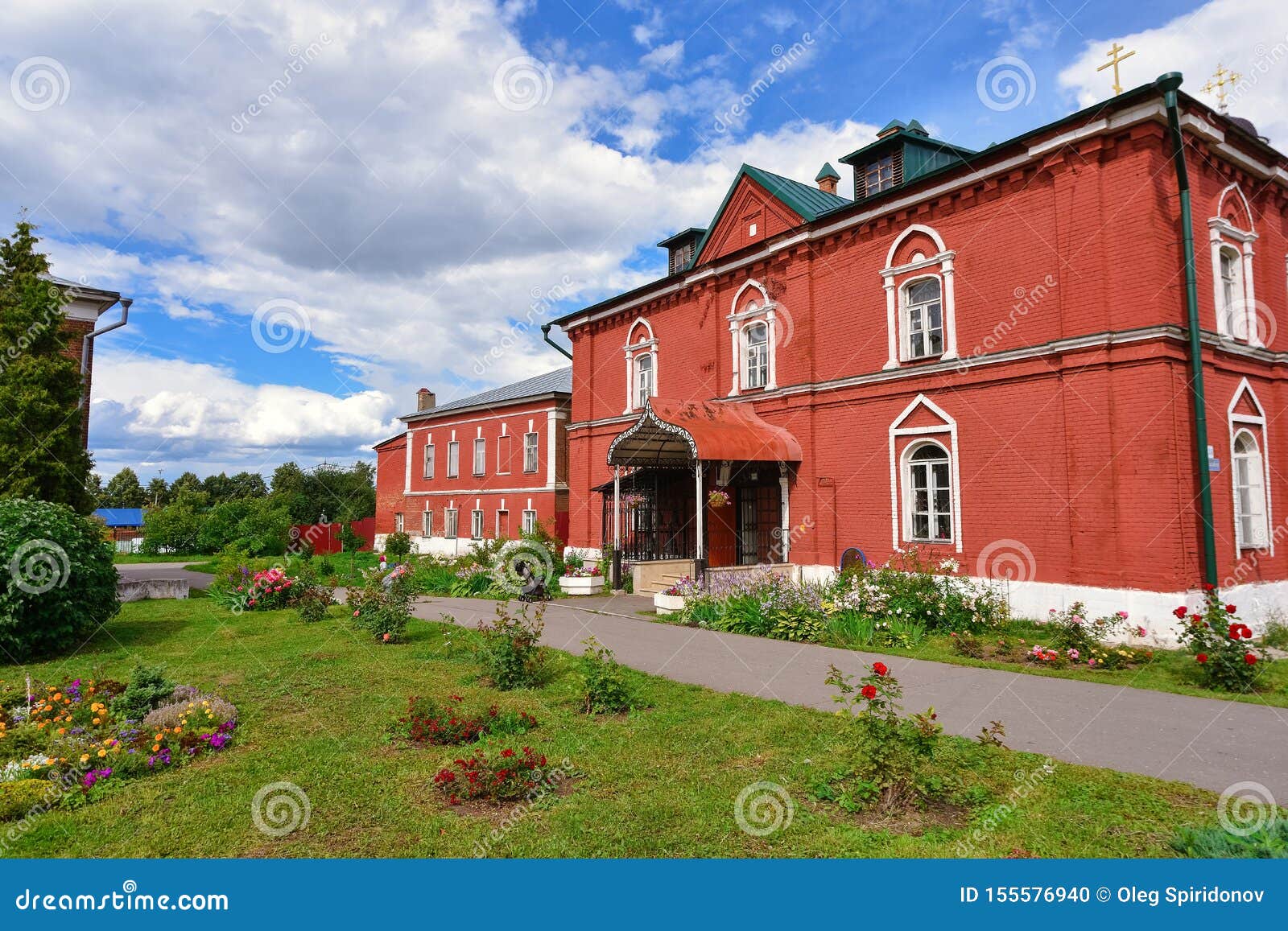 Red House in the Garden on Background of Blue Sky with Clouds Stock ...