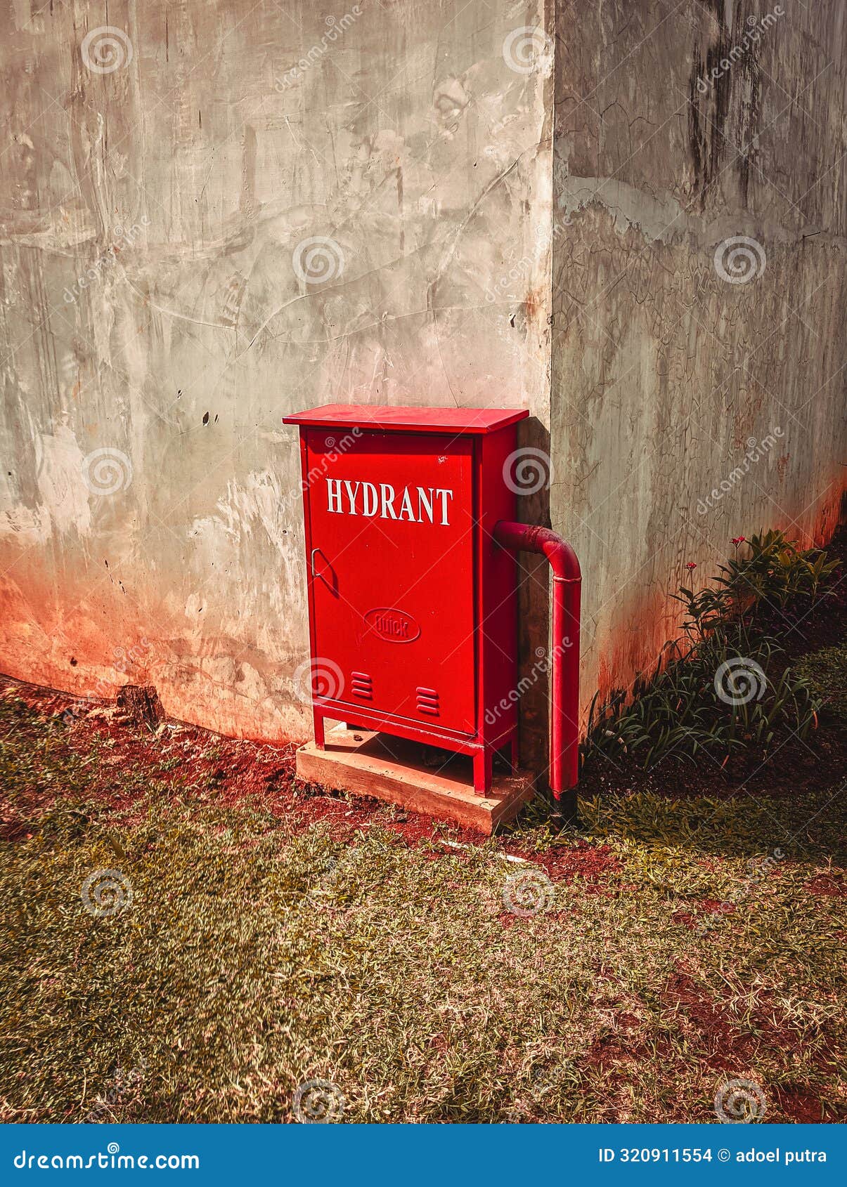 Red Hydrant Box Attached To the Wall of the House Stock Photo - Image ...