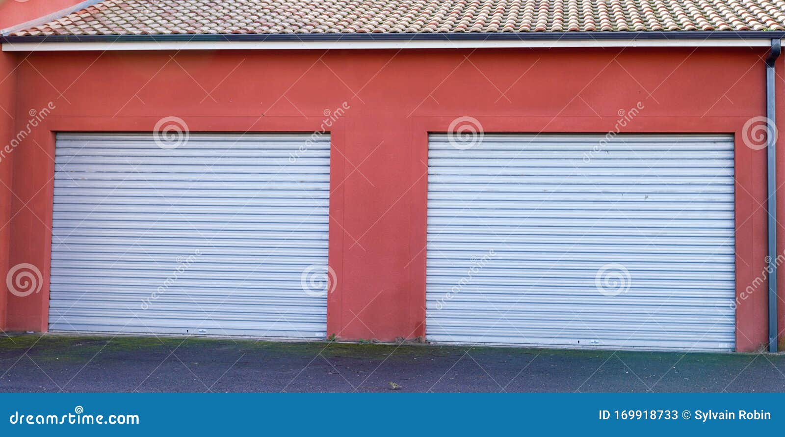 Red Industrial Building Facade Closed Two Grey Roller Shutter Gate ...