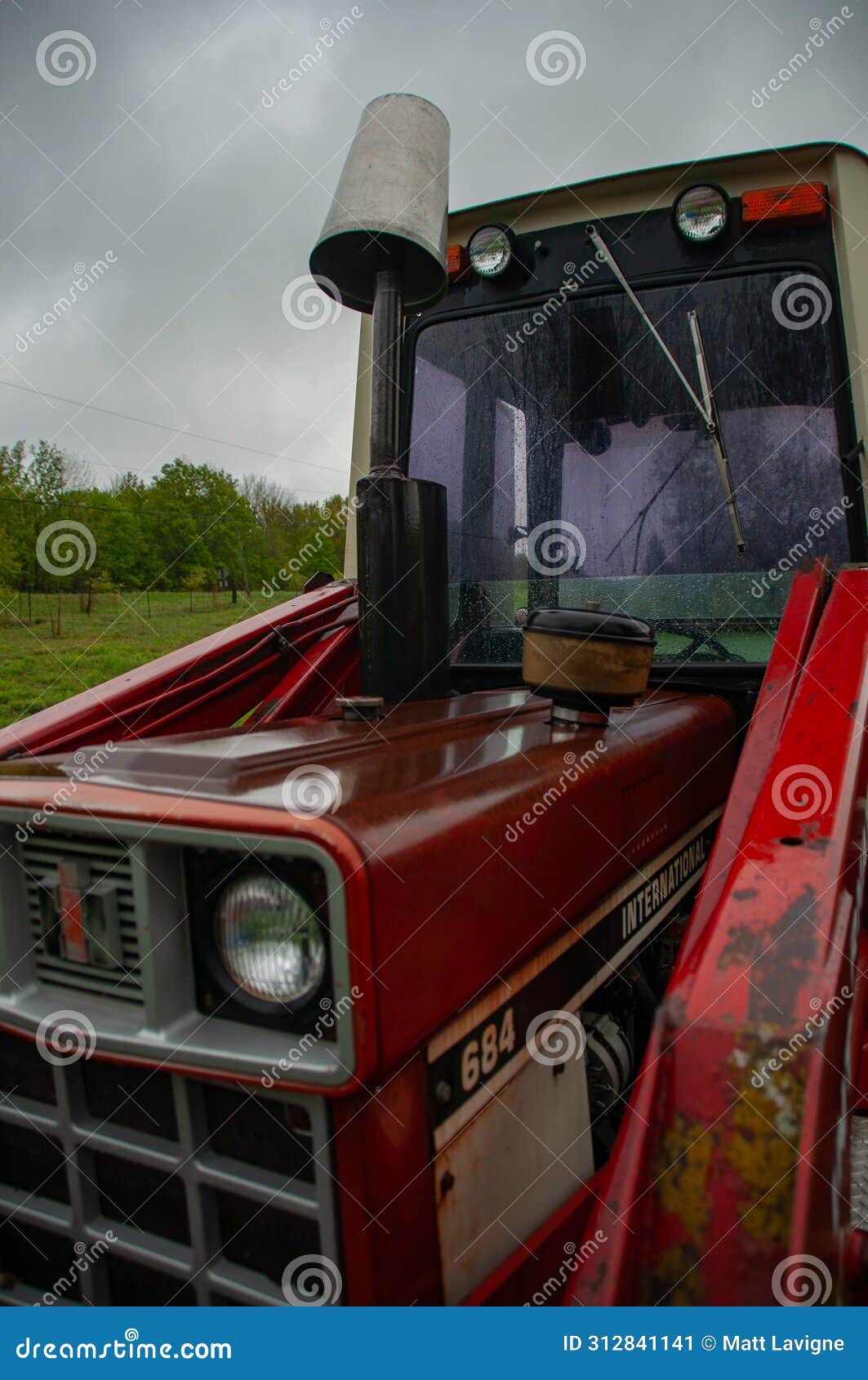 A Red International Tractor on a Meadow Editorial Photo - Image of ...