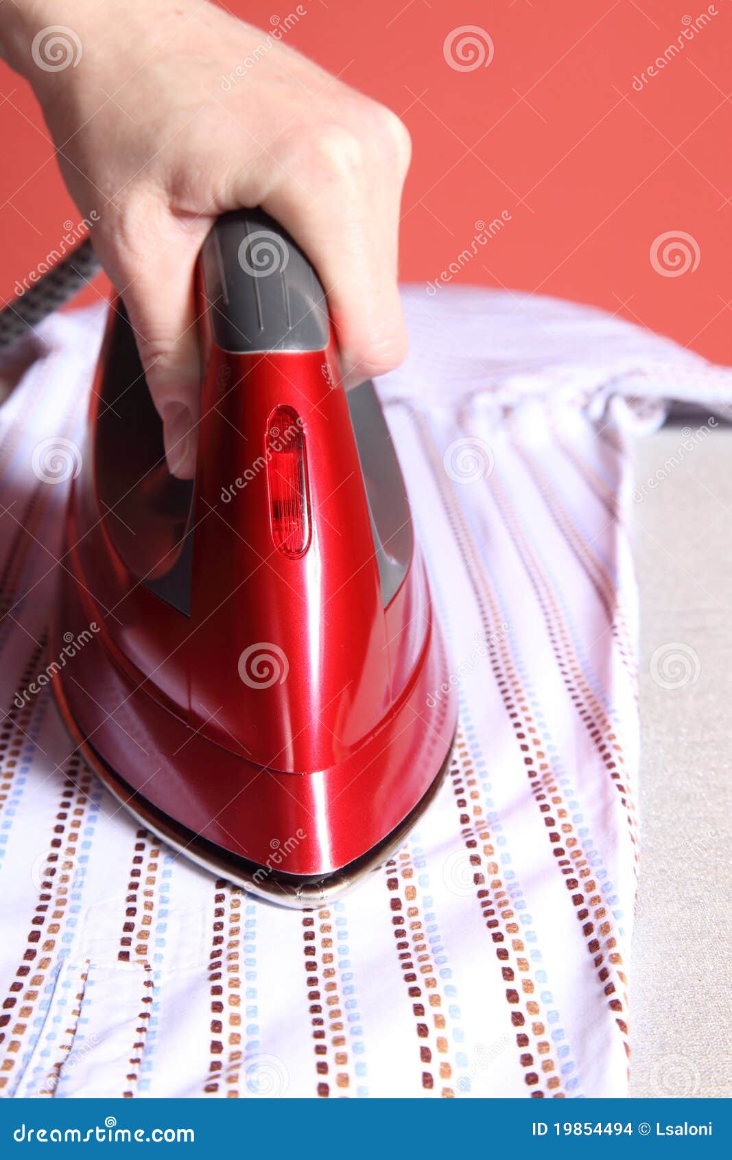 Red Iron in hand and shirt stock photo. Image of wrinkles - 19854494