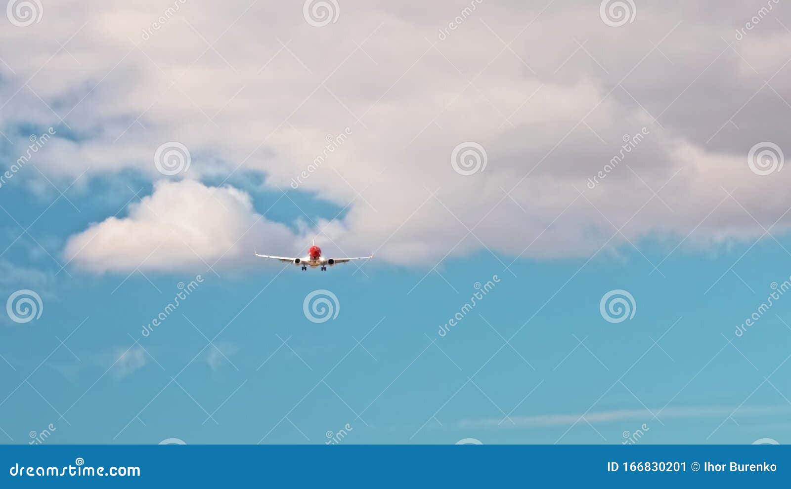 The Red Jet Aircraft Flies Across the Sky with the Chassis Released ...