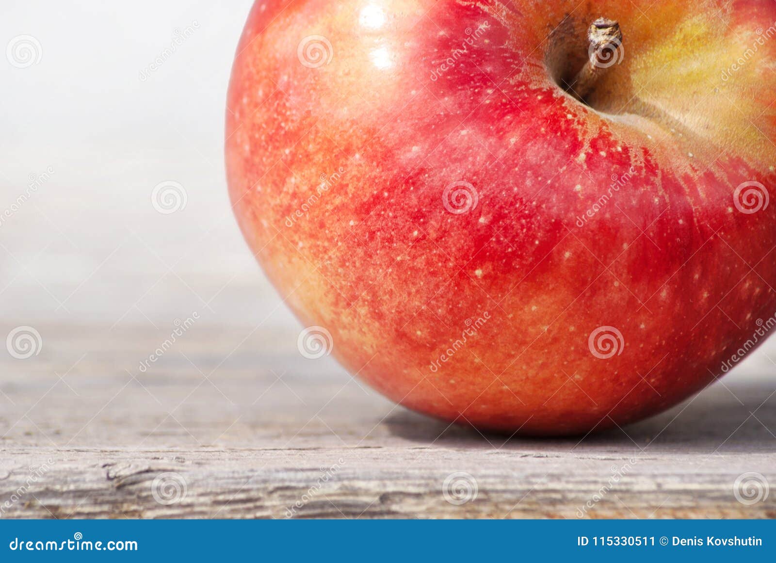 Red Juicy Solid Fruit Apple Under Sunlight on a Blackboard Against a ...