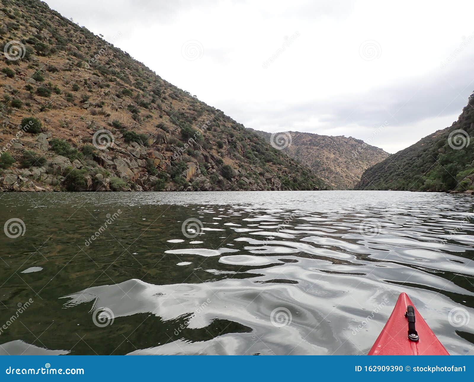 Red Kayak Boat on River Water with Hills Stock Photo - Image of nature ...