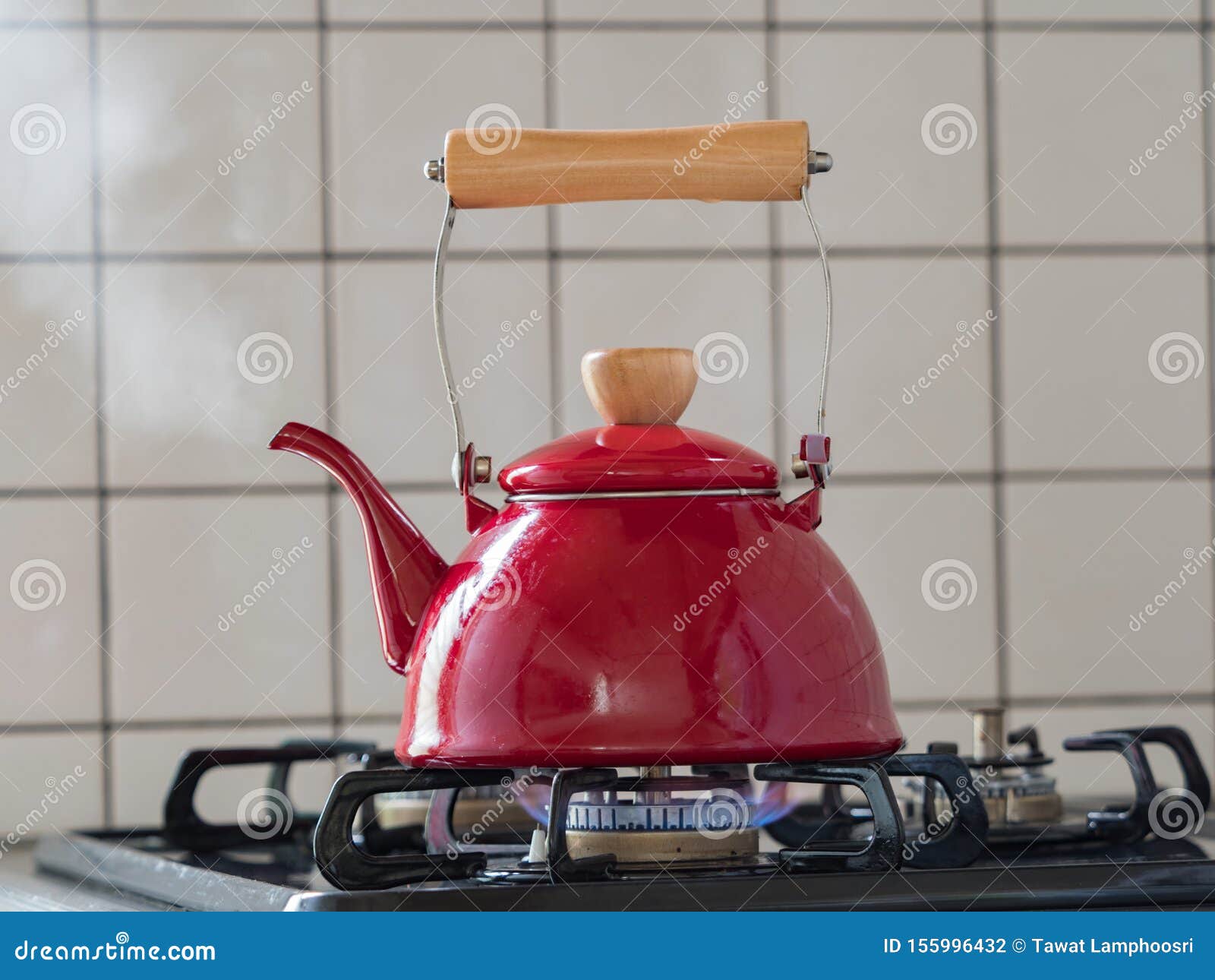 Red kettle steaming hot. stock photo. Image of reflective - 155996432