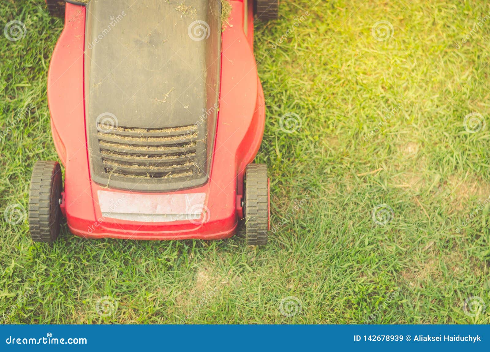 Red Lawn Mower Cutting Green Grass/red Lawn Mower Cutting Green Grass ...