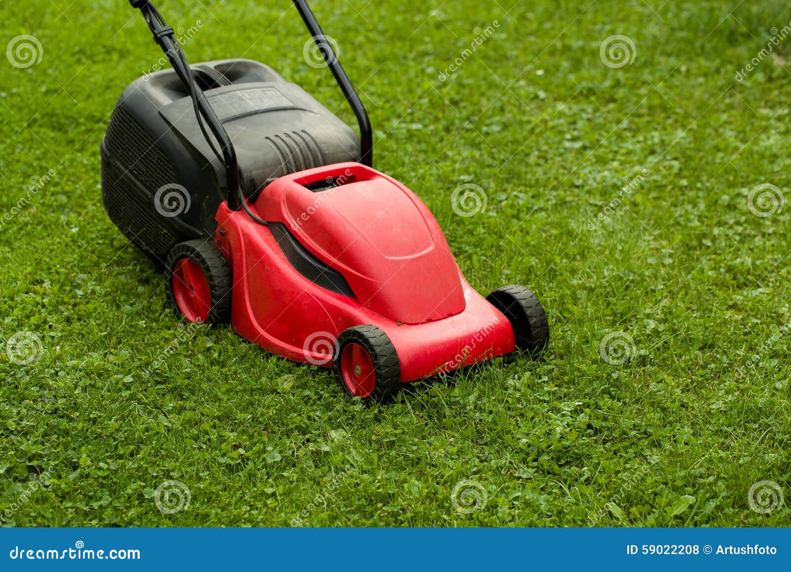 Red Lawnmower on Green Grass Stock Photo - Image of landscaping ...