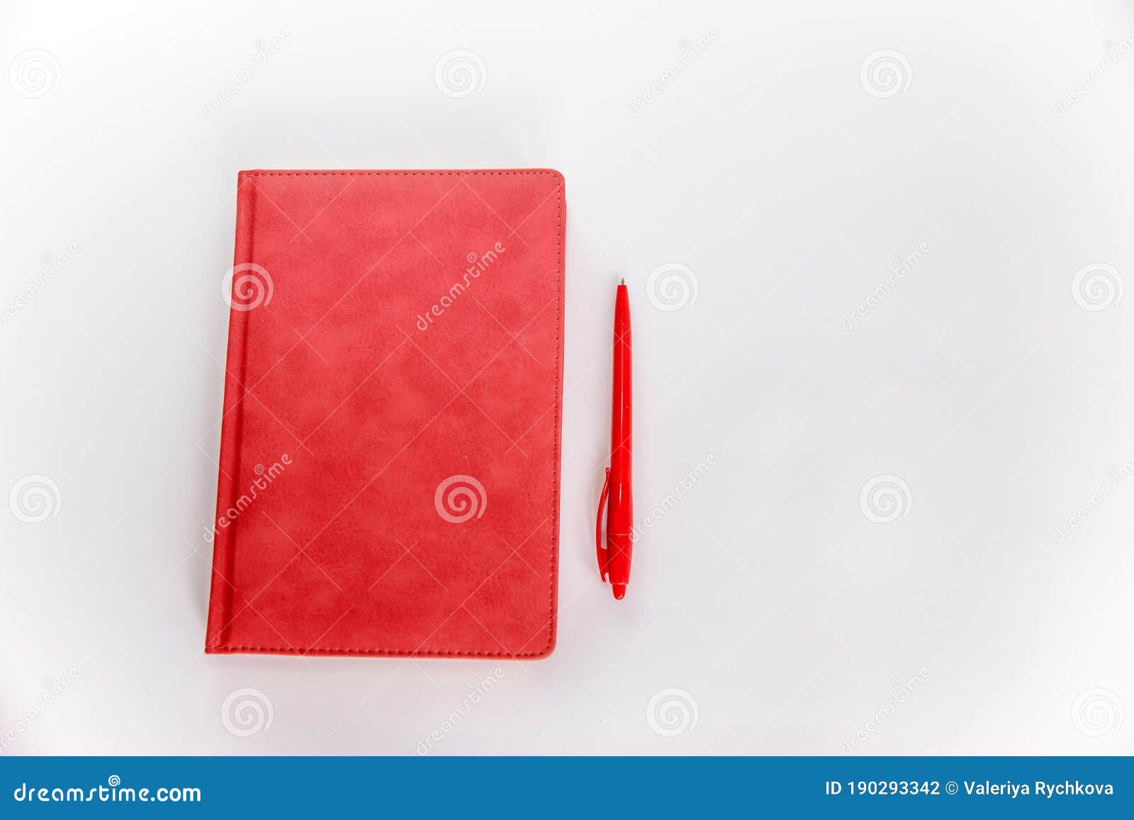 Red Leather daily Planner with a Pen Isolated on White Background Stock ...
