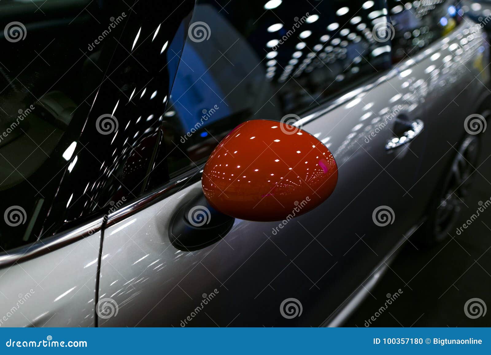 Red Left Side Car Mirror with Reflection of a Modern Car. Car Exterior ...