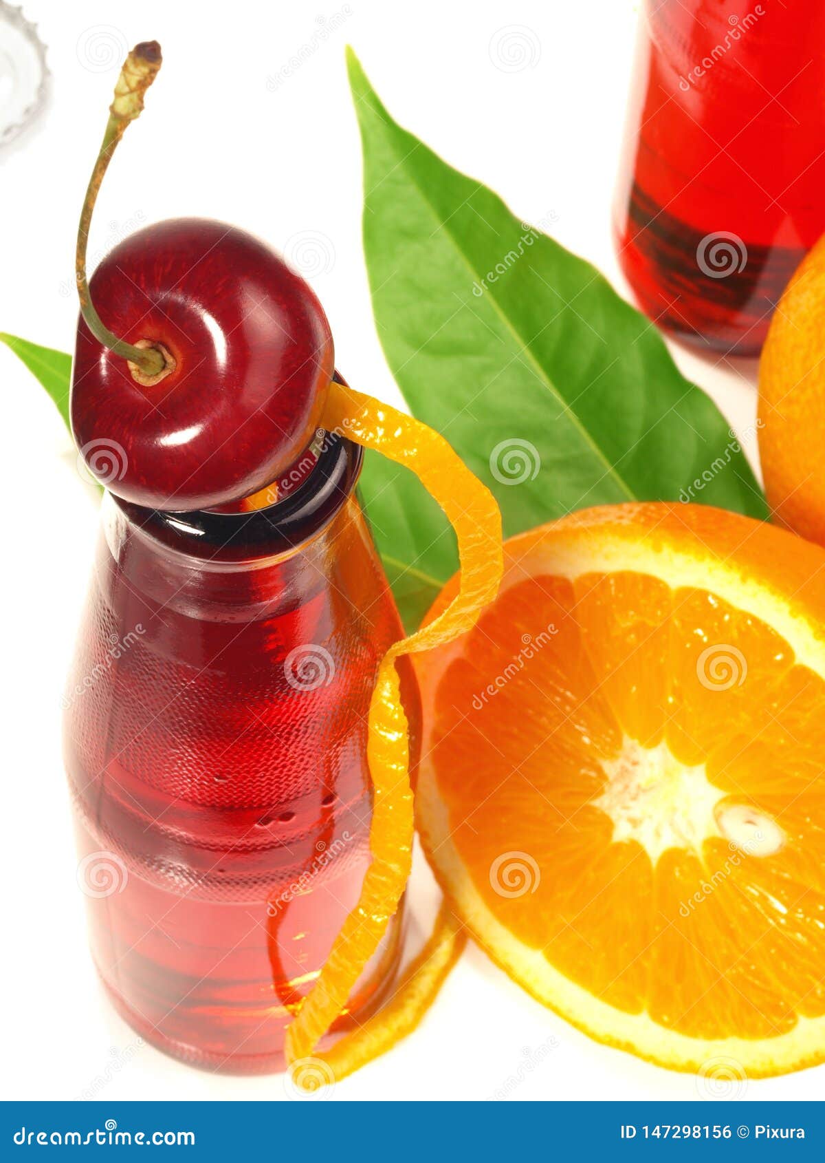 Red Lemonade in Bottles with Cherry on White Background Stock Photo ...