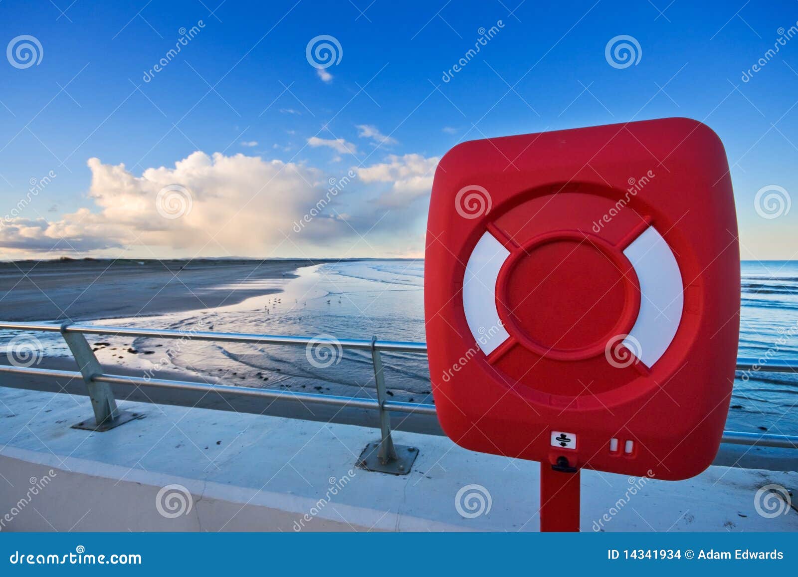 Red Life Ring by a Beach at Sunset Stock Photo - Image of cloud, life ...