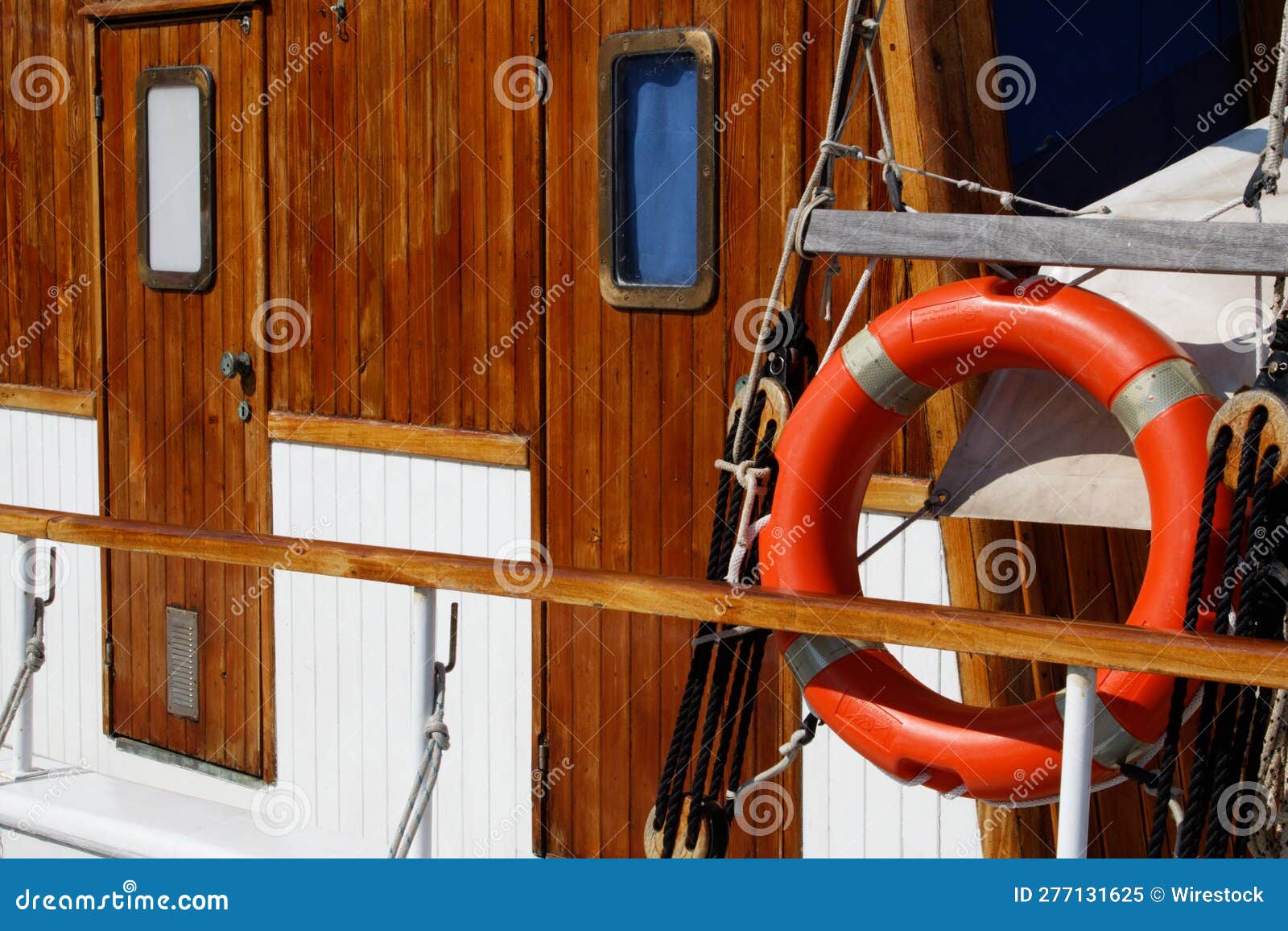 Red Lifebuoy Attached To the Railing of a Boat Deck Stock Image - Image ...