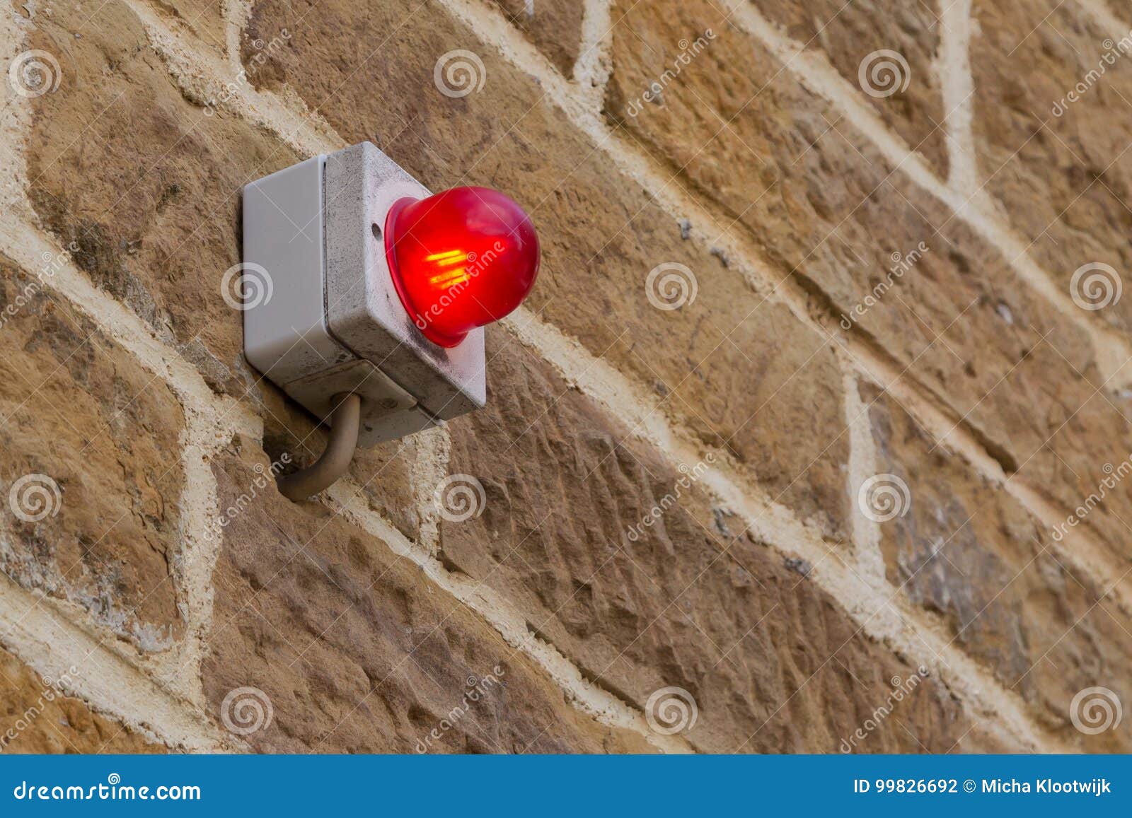 Red light on a brick wall stock photo. Image of emergency - 99826692