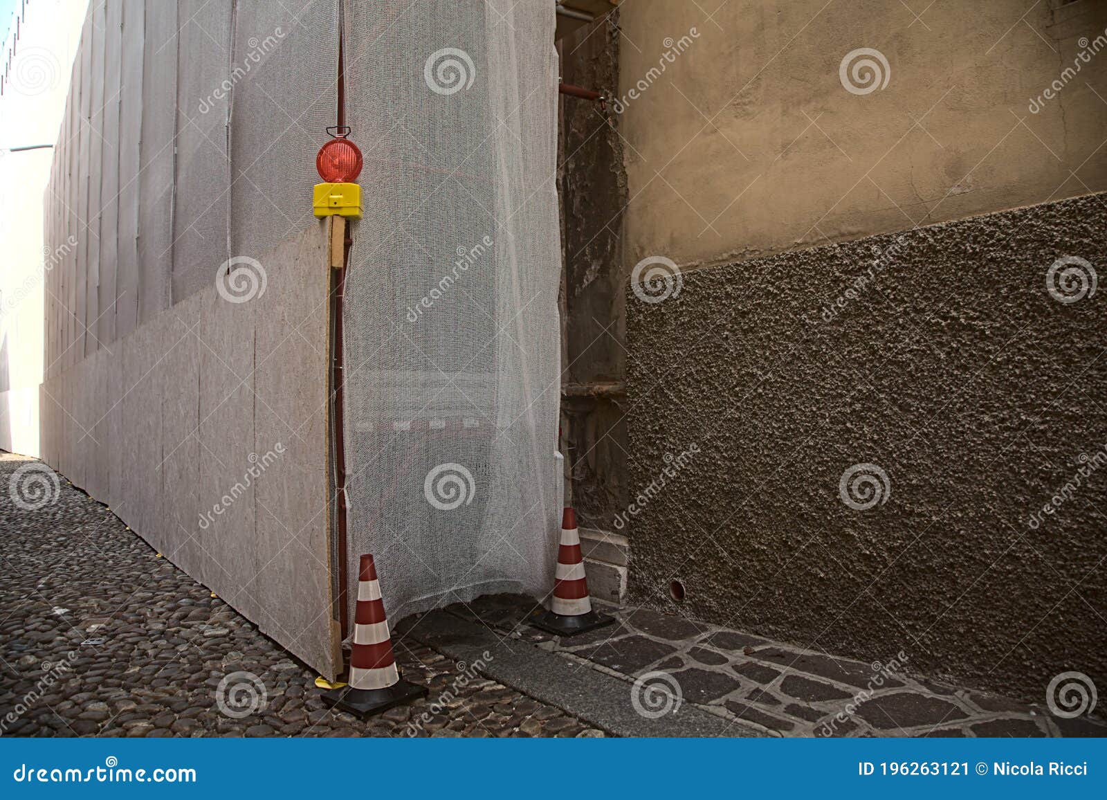 Red Light and Cones at the Edge of a White Tarp Stock Image - Image of ...