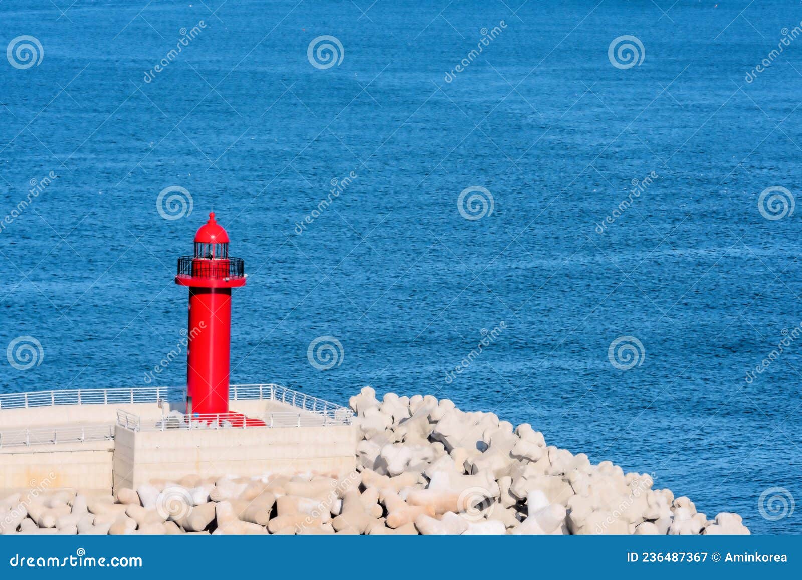 Red Light House with Ocean Water in Background Stock Image - Image of ...
