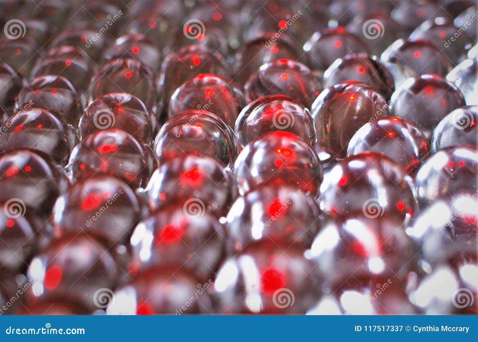 Red Light Reflects Off Clear Marbles Stock Image - Image of shiny, flow ...
