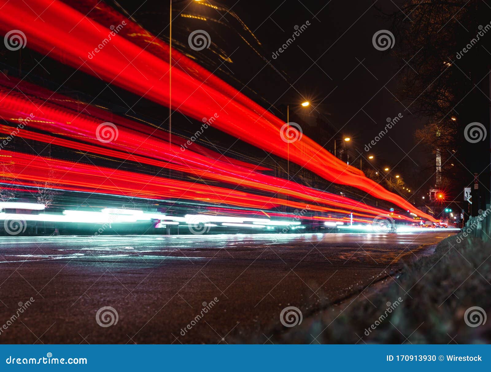 Red Light Trails in the Illuminated Highway at Night Stock Photo ...