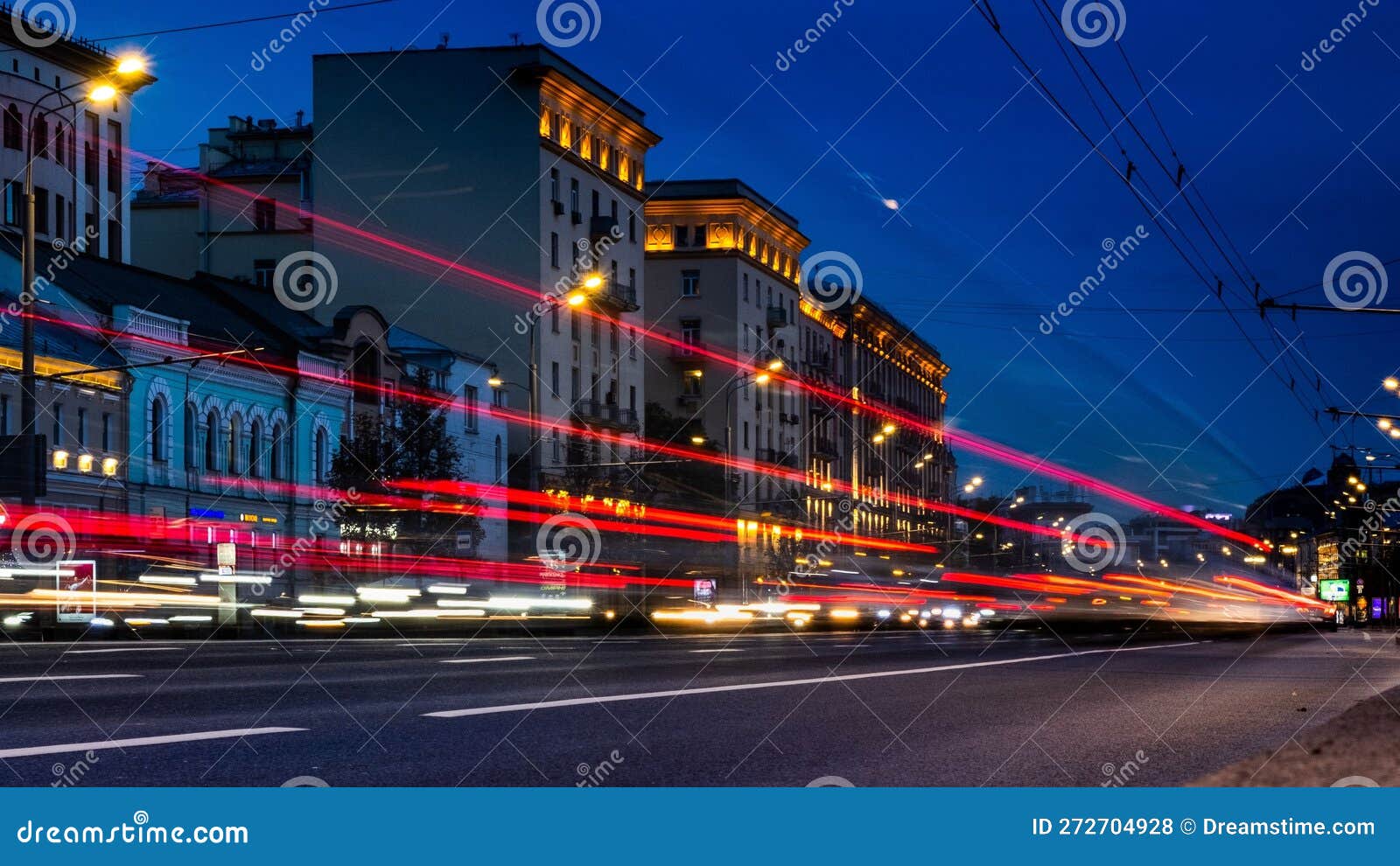 Light Trails in Urban Setting with a Backdrop of Towering Skyscrapers ...