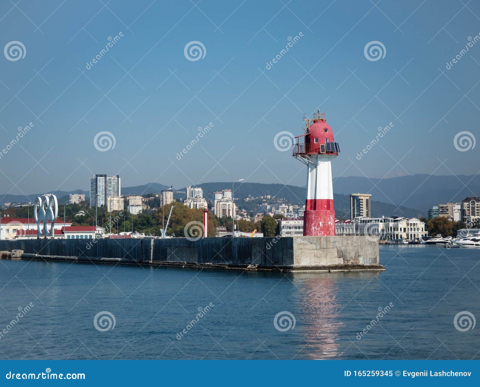 Red Lighthouse with Birds on a Pier in the Sea Stock Image - Image of ...