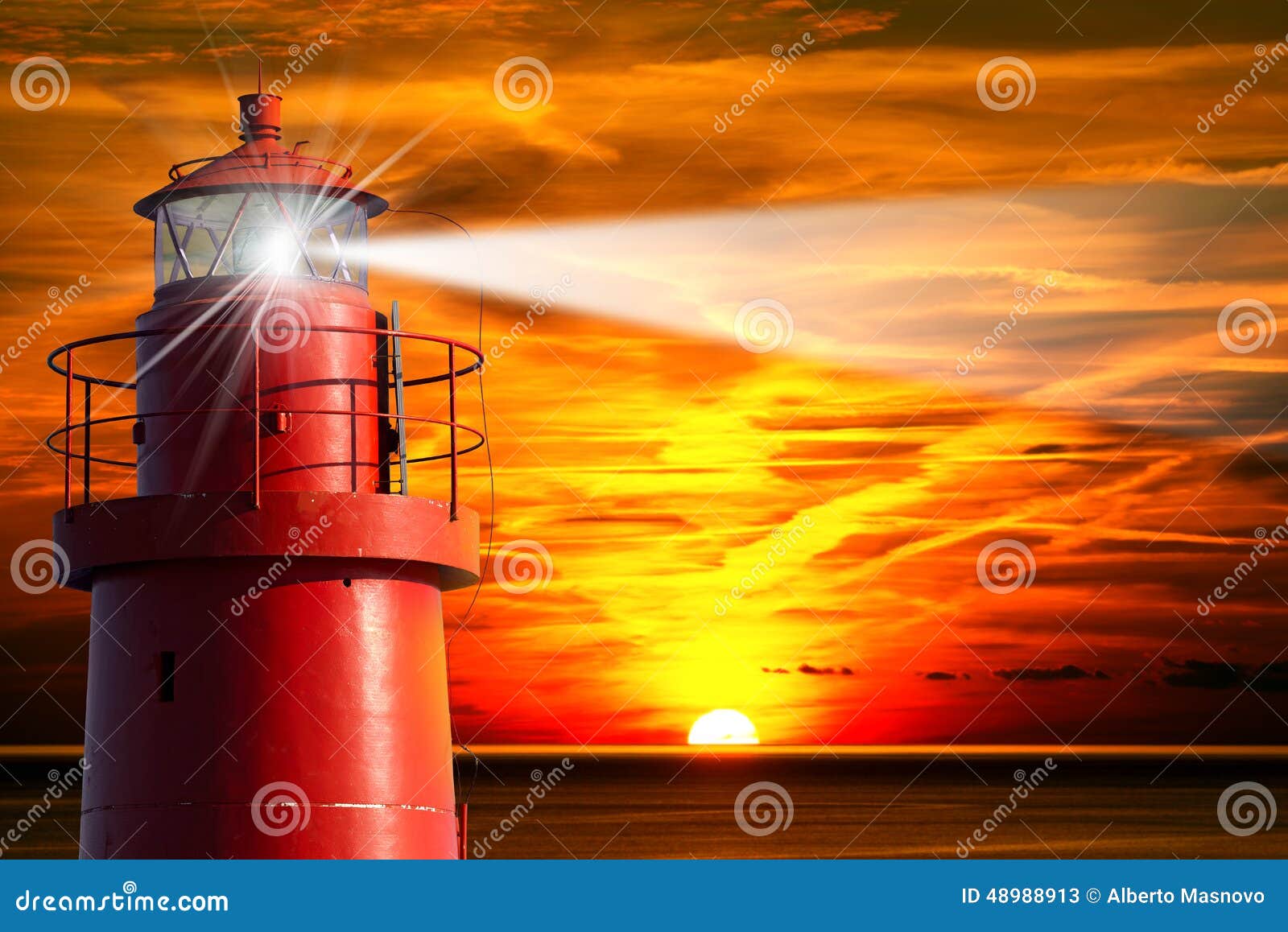 Red Lighthouse with Light Beam at Sunset Stock Image - Image of cloud ...