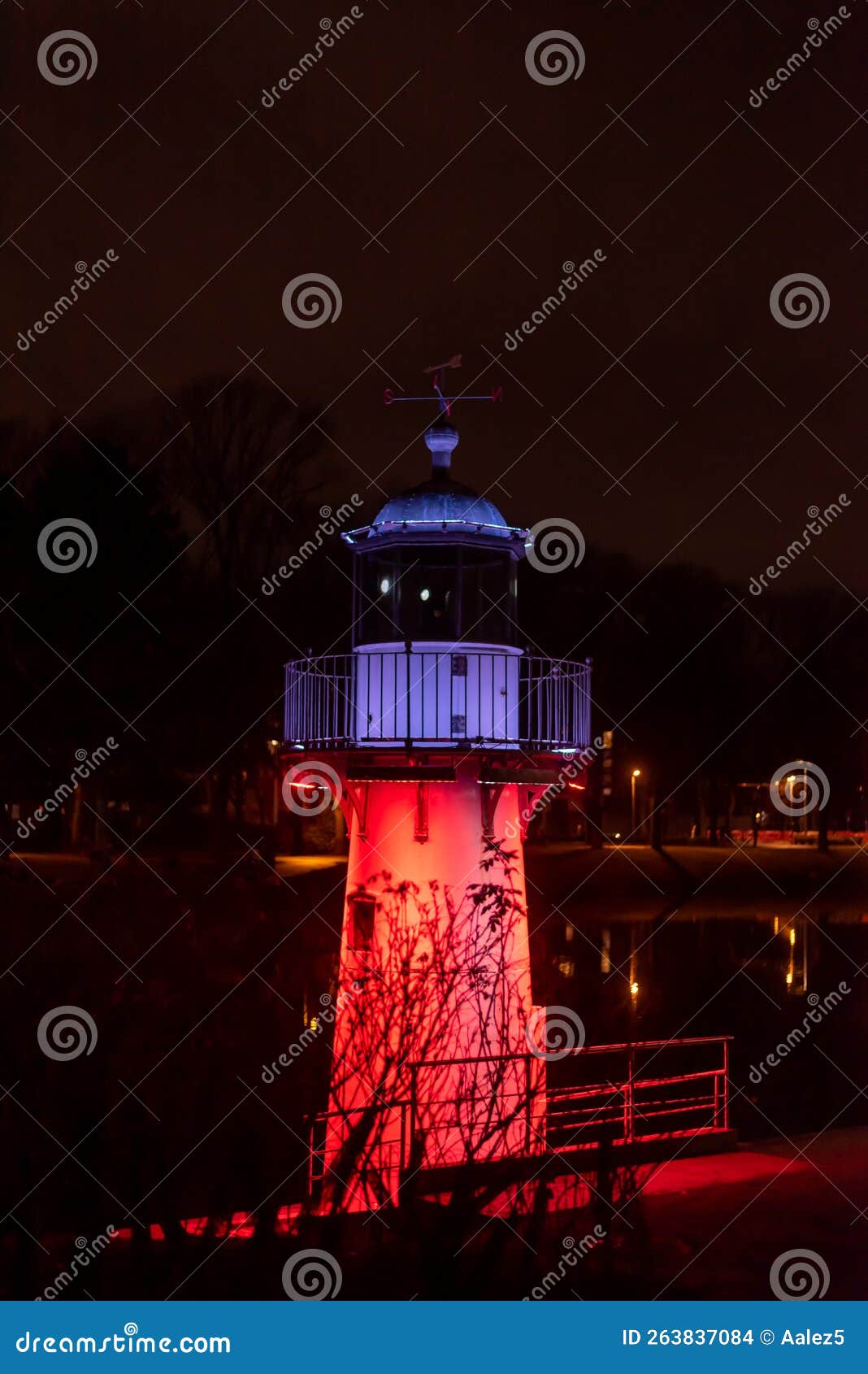 Red Lighthouse at Night at the Side of a River Stock Photo - Image of ...