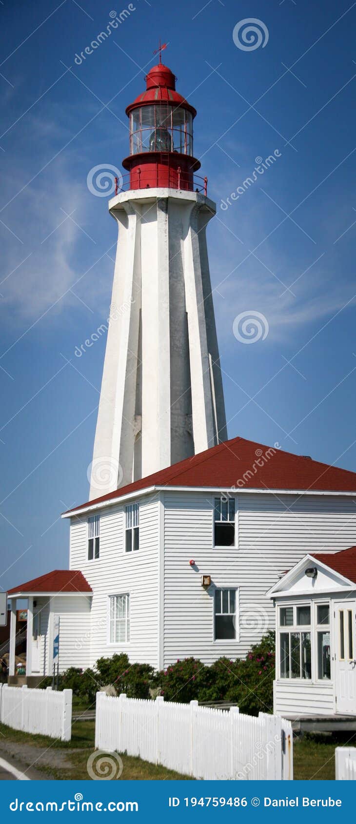 Red Lighthouse on the sea stock photo. Image of american - 194759486