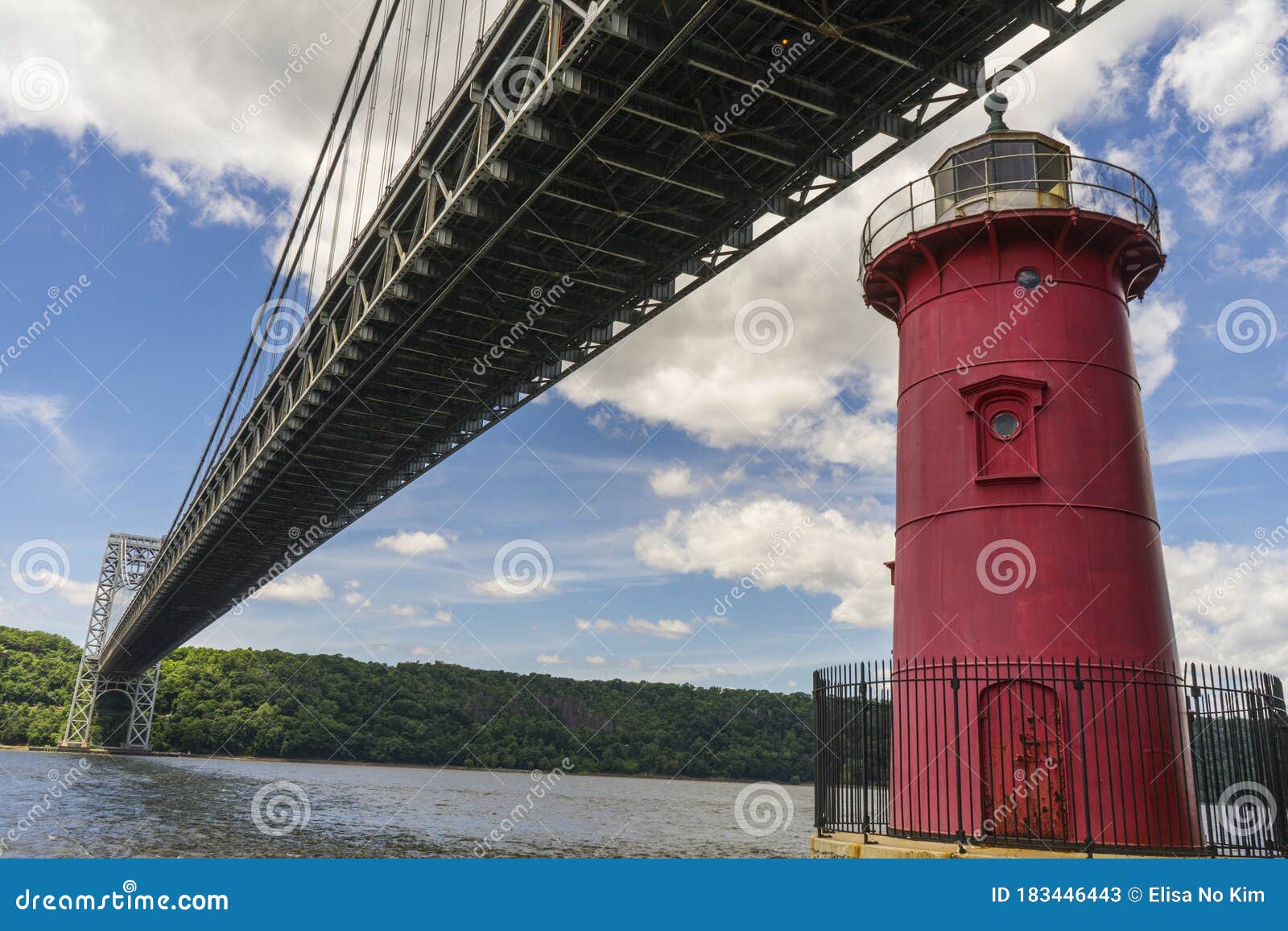 Red Lighthouse Under a Bridge Stock Image - Image of bridge, mountains ...