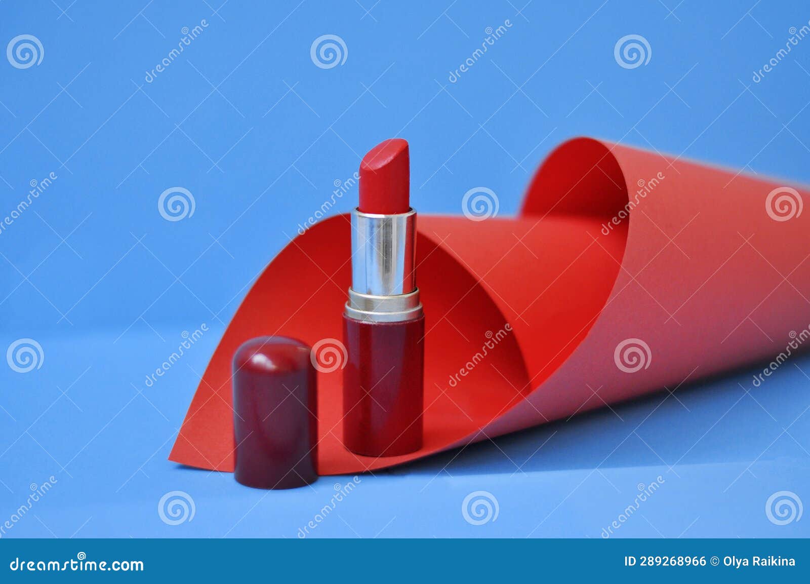 A Red Lipstick and Blue Background Stock Photo - Image of pink, petal ...
