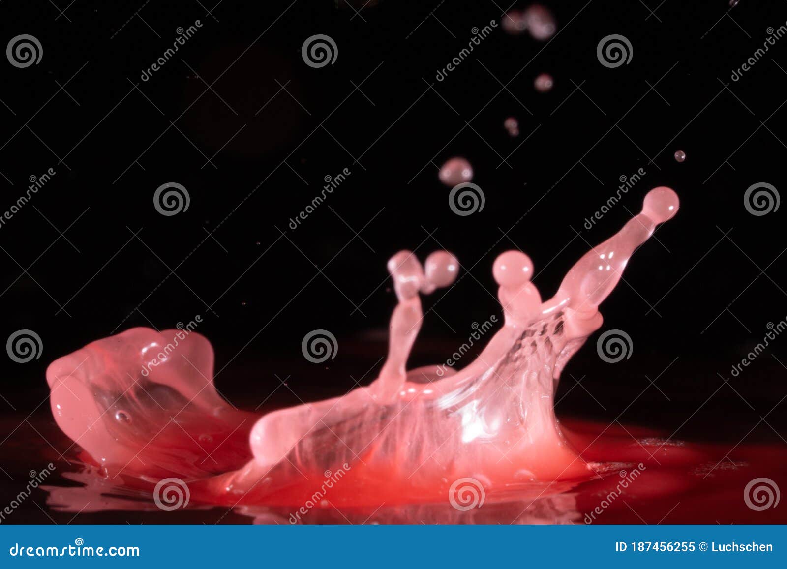 Red Liquid Ink Splash on Black Background Stock Image - Image of ...