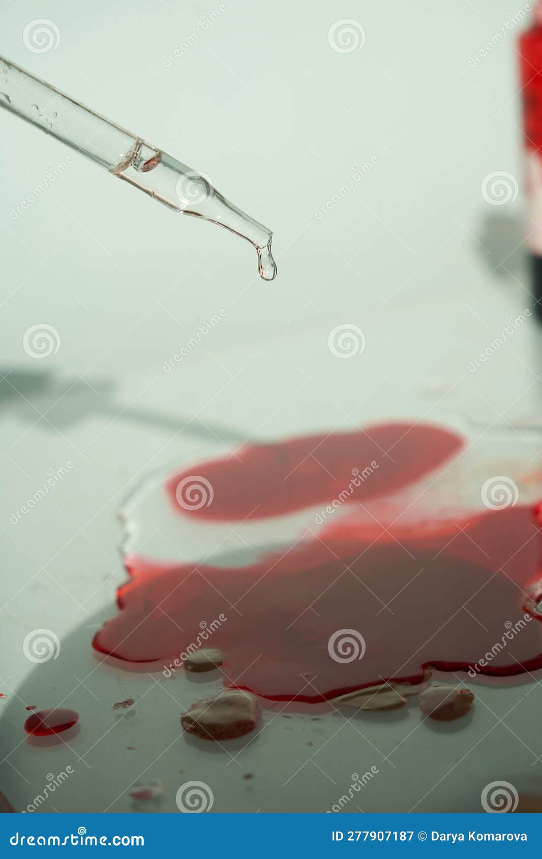 Red Liquid with a Pipette in the Form of a Spot on a Light Background ...