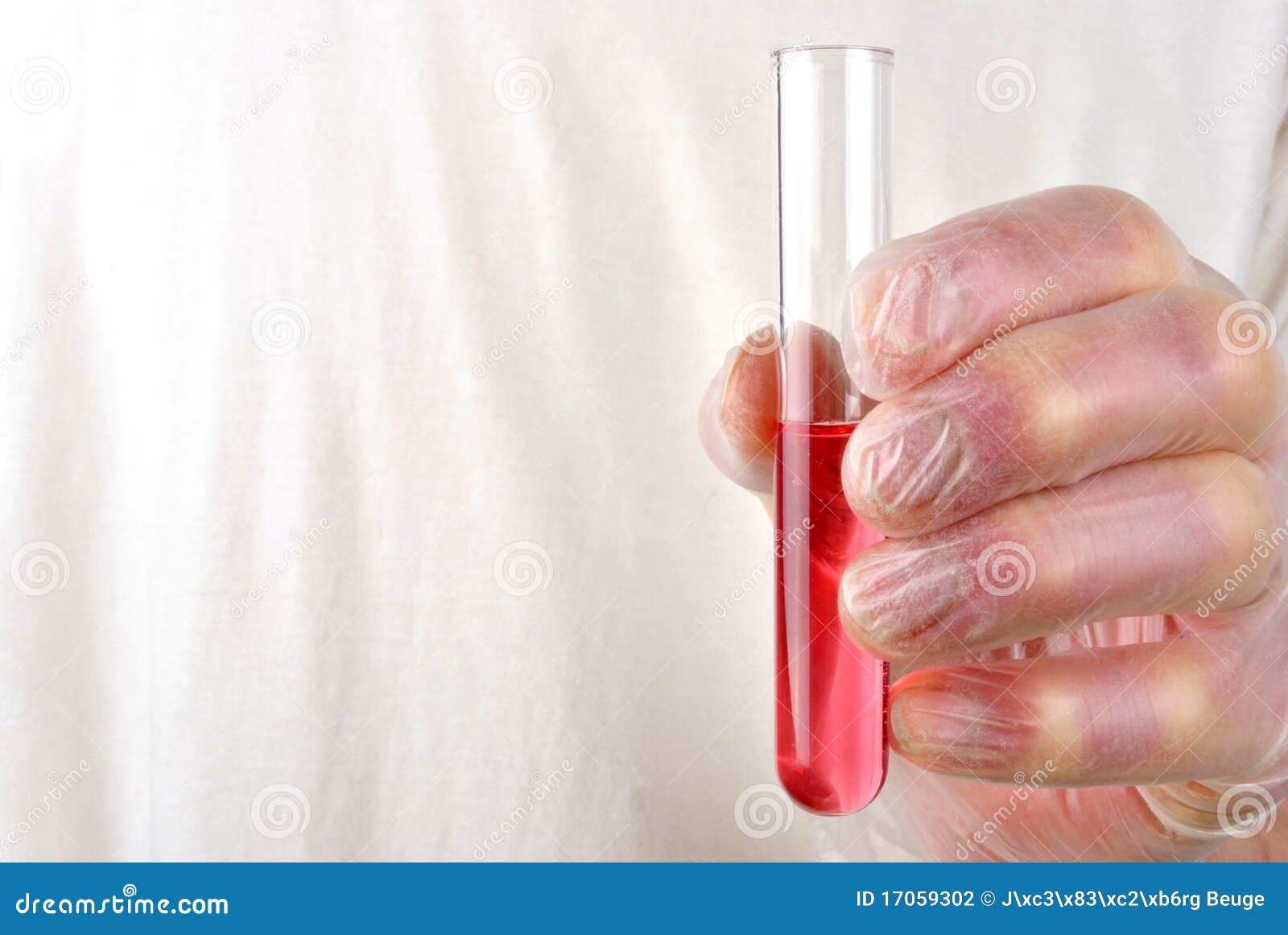 Red liquid in a test tube stock photo. Image of finger - 17059302
