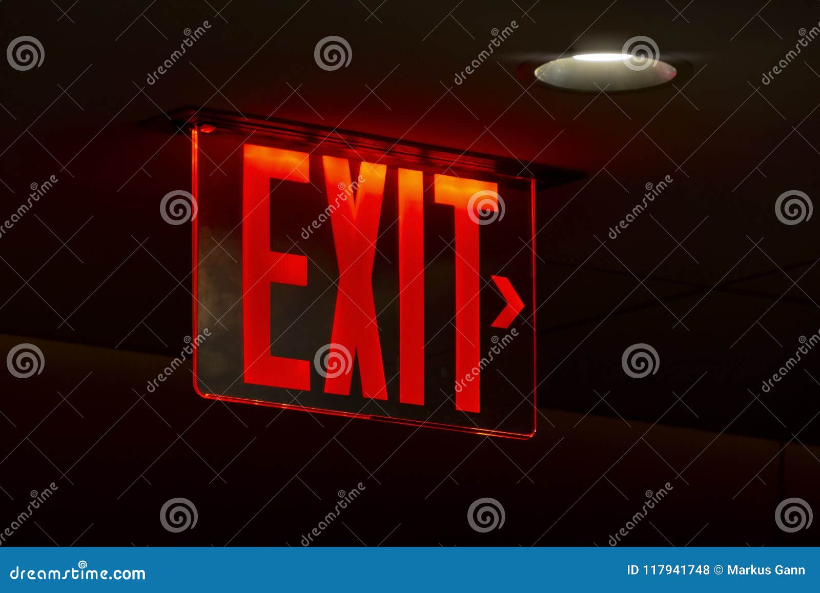A red lit exit sign stock photo. Image of hallway, illuminated - 117941748