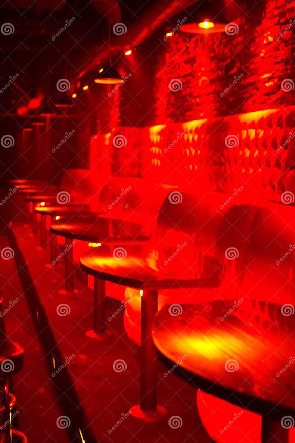 Red lit Lounge stock image. Image of line, booth, night - 66636529
