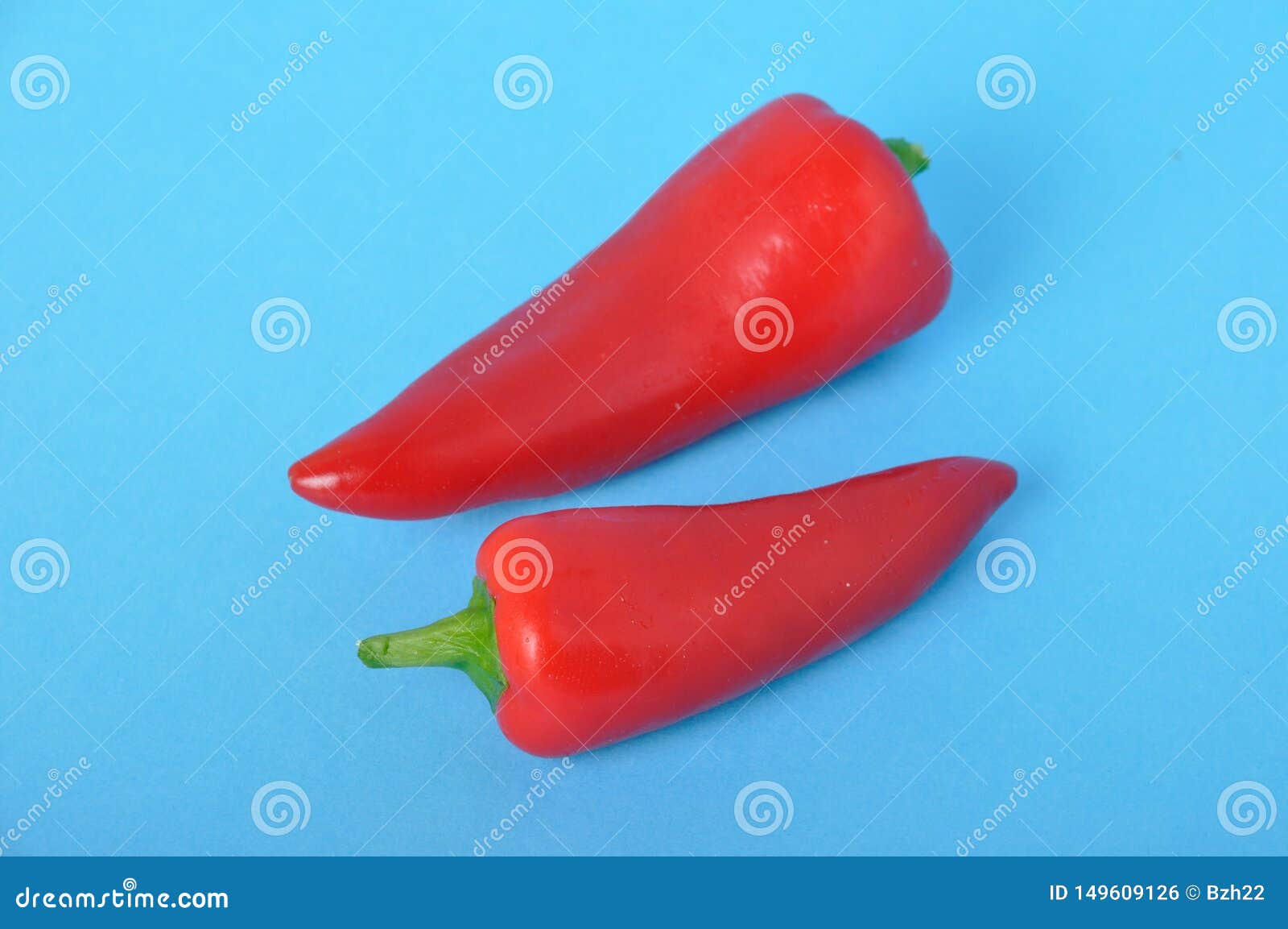 Red Long Pepper on Blue Background Stock Photo - Image of studio ...