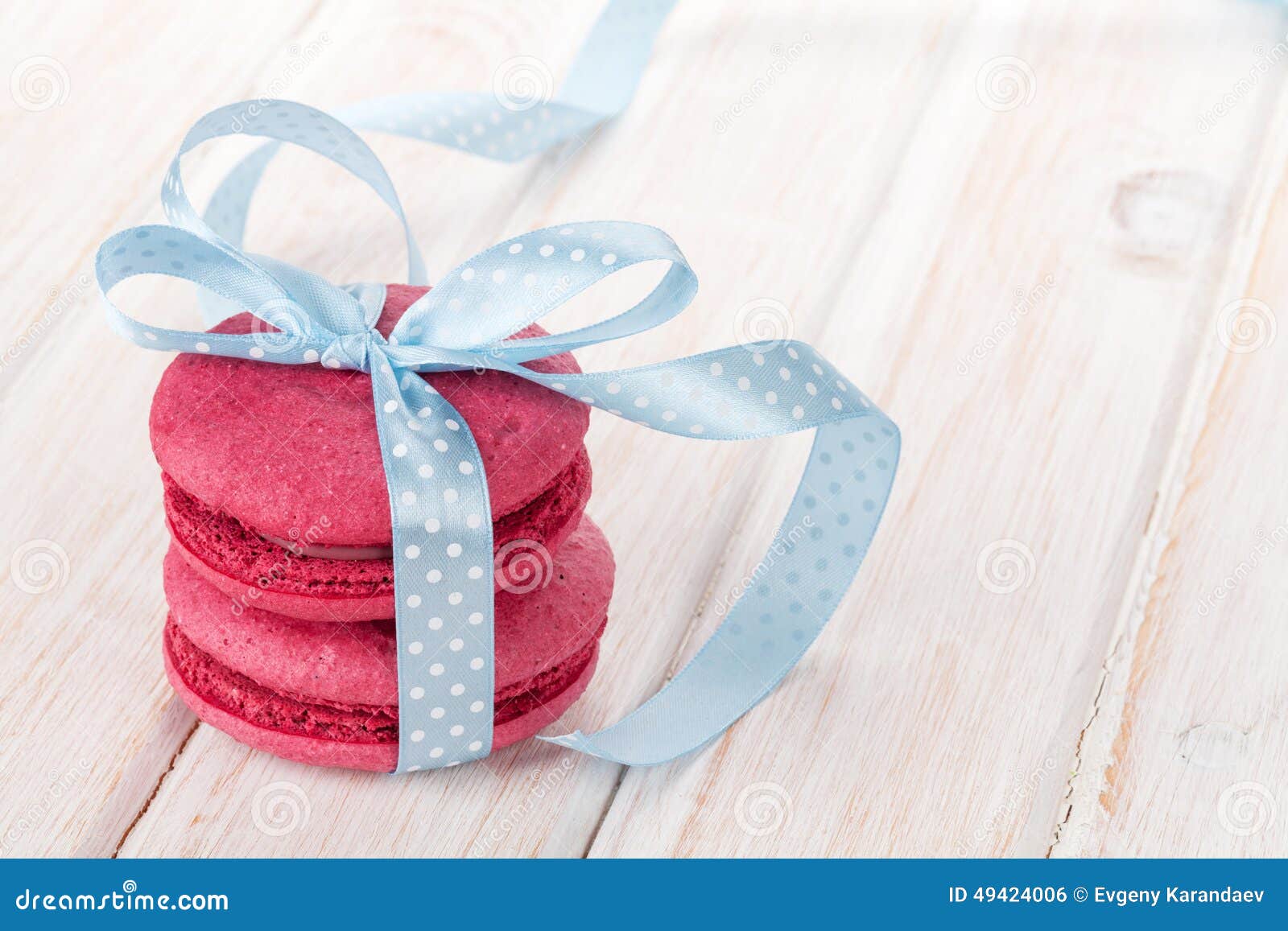 Red Macarons with Blue Ribbon Stock Photo - Image of dessert, macaroon ...