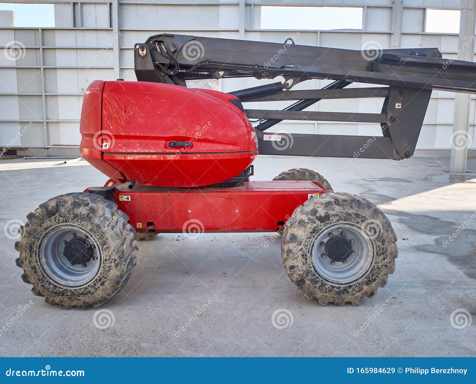 Red Man Lifting Platform Machinery at Construction Site Stock Image ...