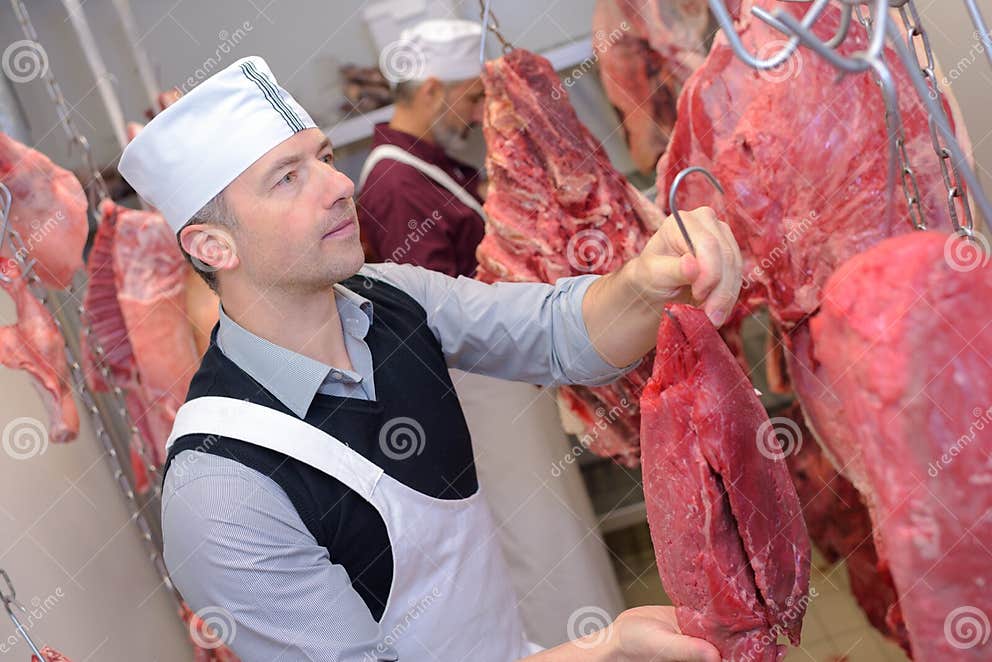 Red meat hanging on hooks stock photo. Image of diet - 103883158