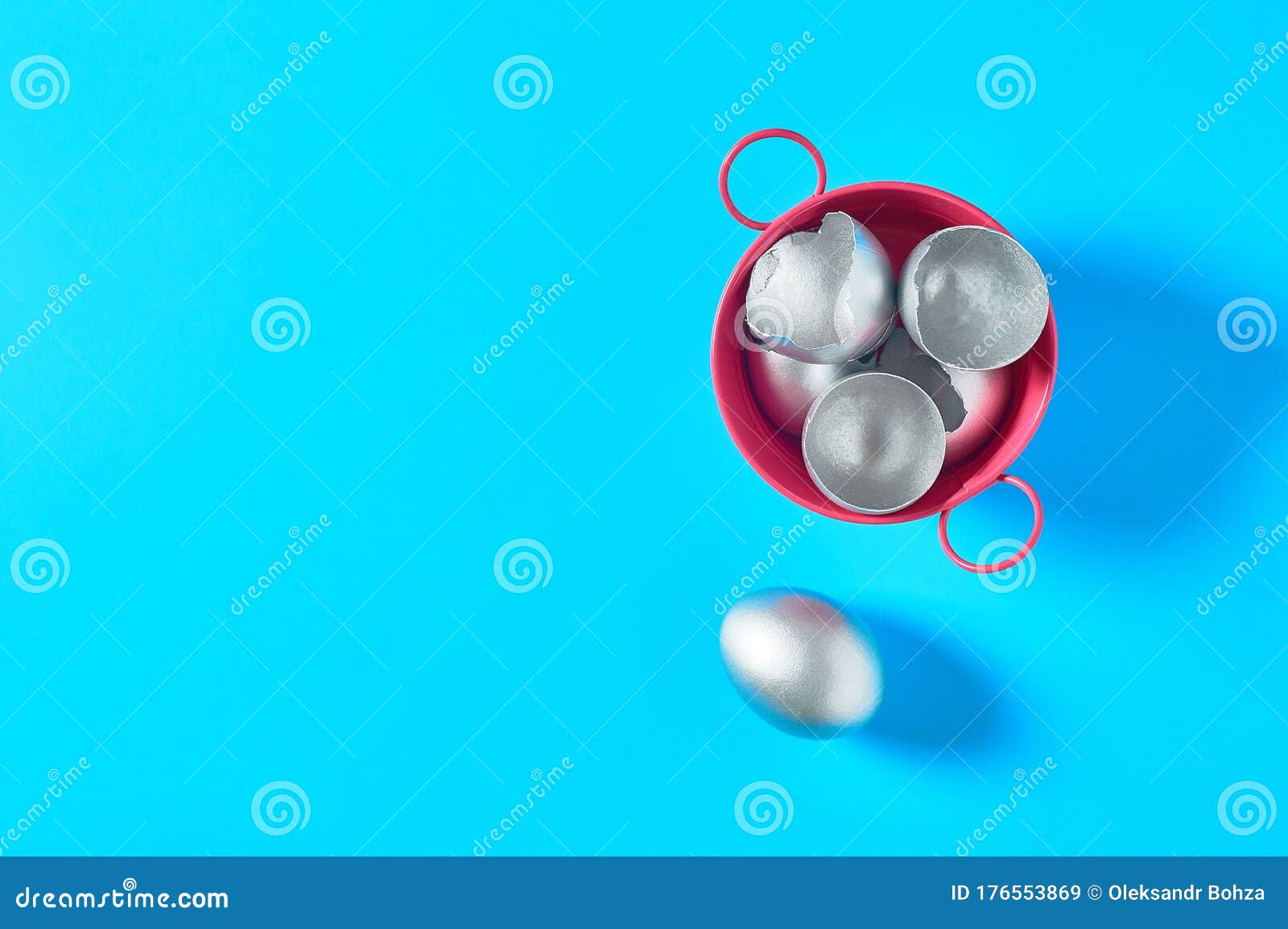 Red Metal Basin Full of Silver Egg Shells on Blue Background. Easter ...
