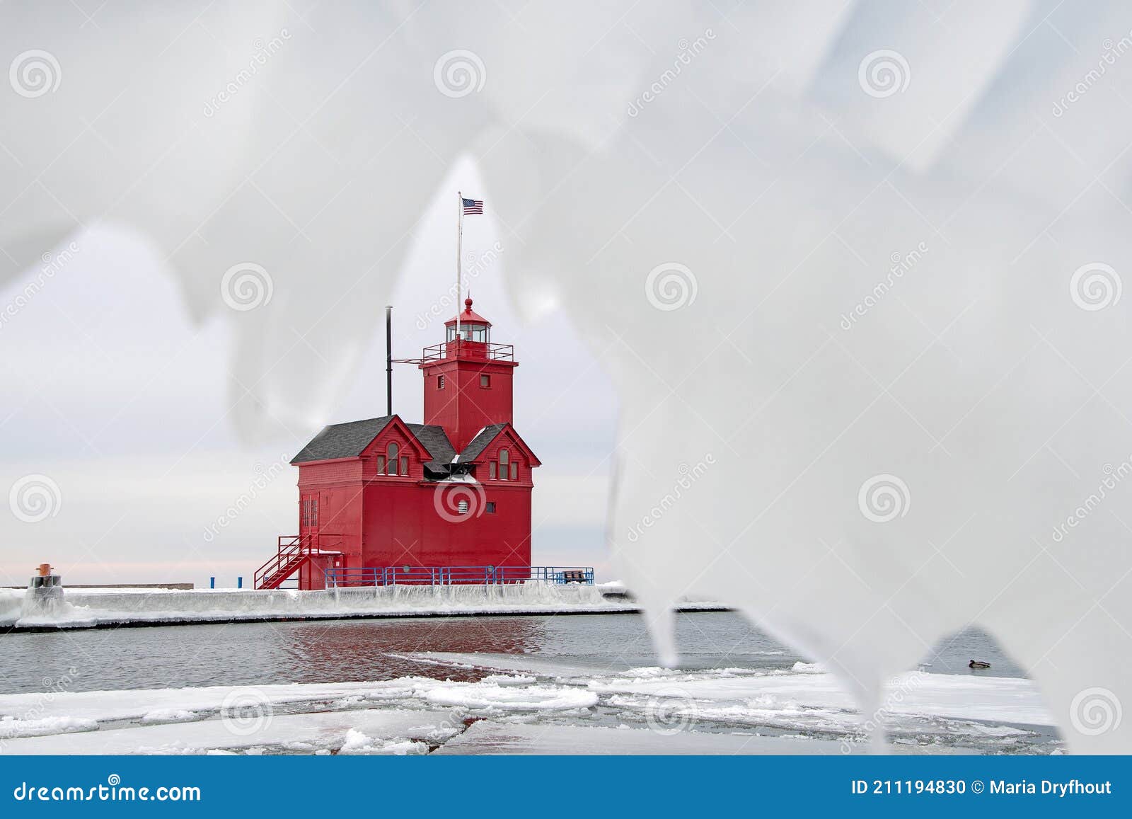 Red Michigan Lighthouse Framed in Ice Stock Photo - Image of coast ...
