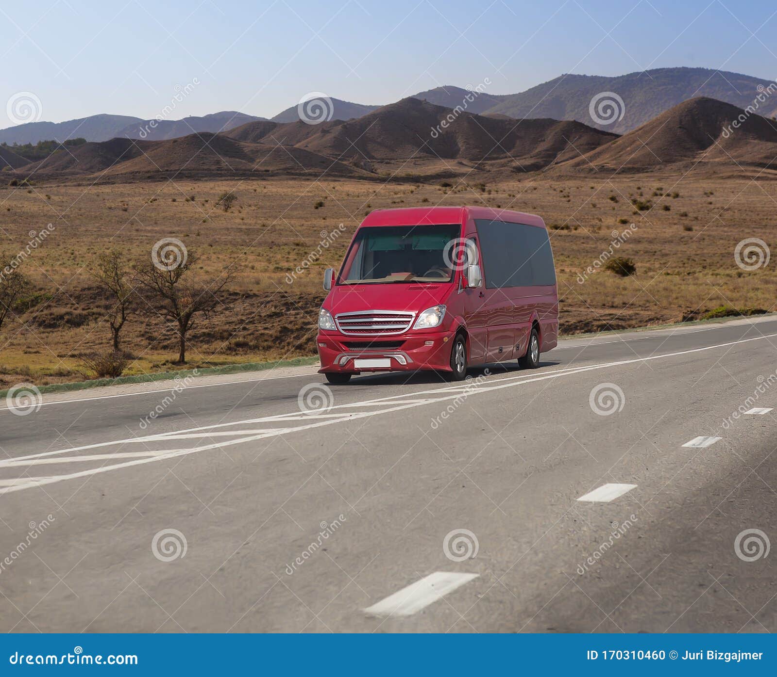 Red Minibus Moves on a Road in the Mountains Stock Photo - Image of ...