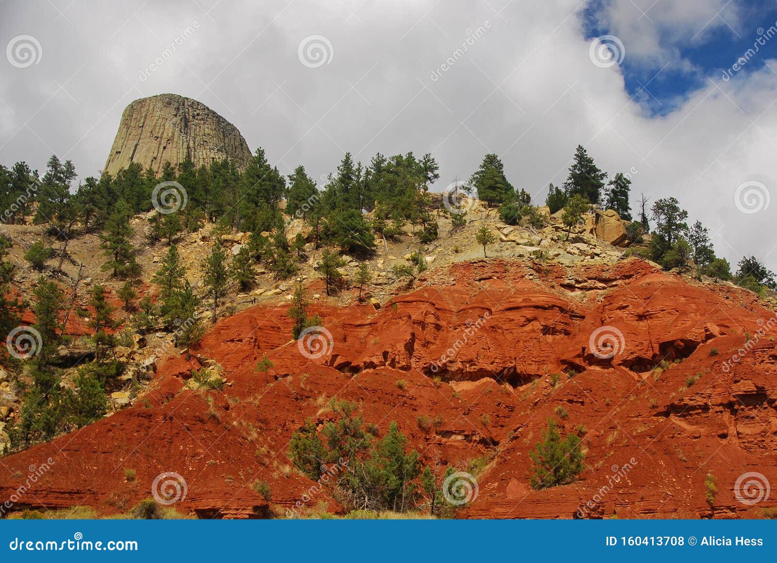 Red Mountain Cliffs with Devils Tower in the Background Stock Photo ...