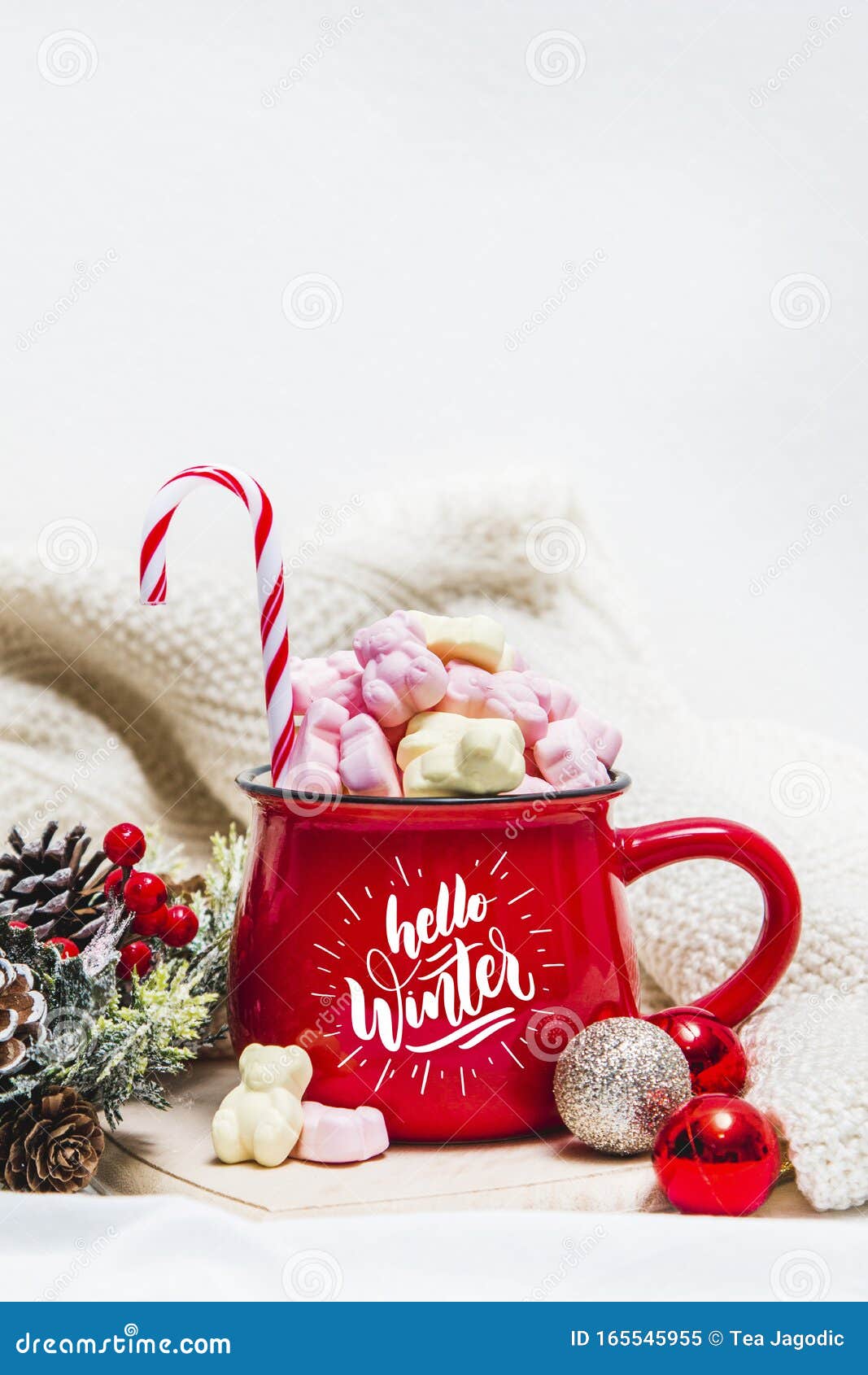 Red Mug with Marshmallows and Winter Ornaments on a White Sheets with ...